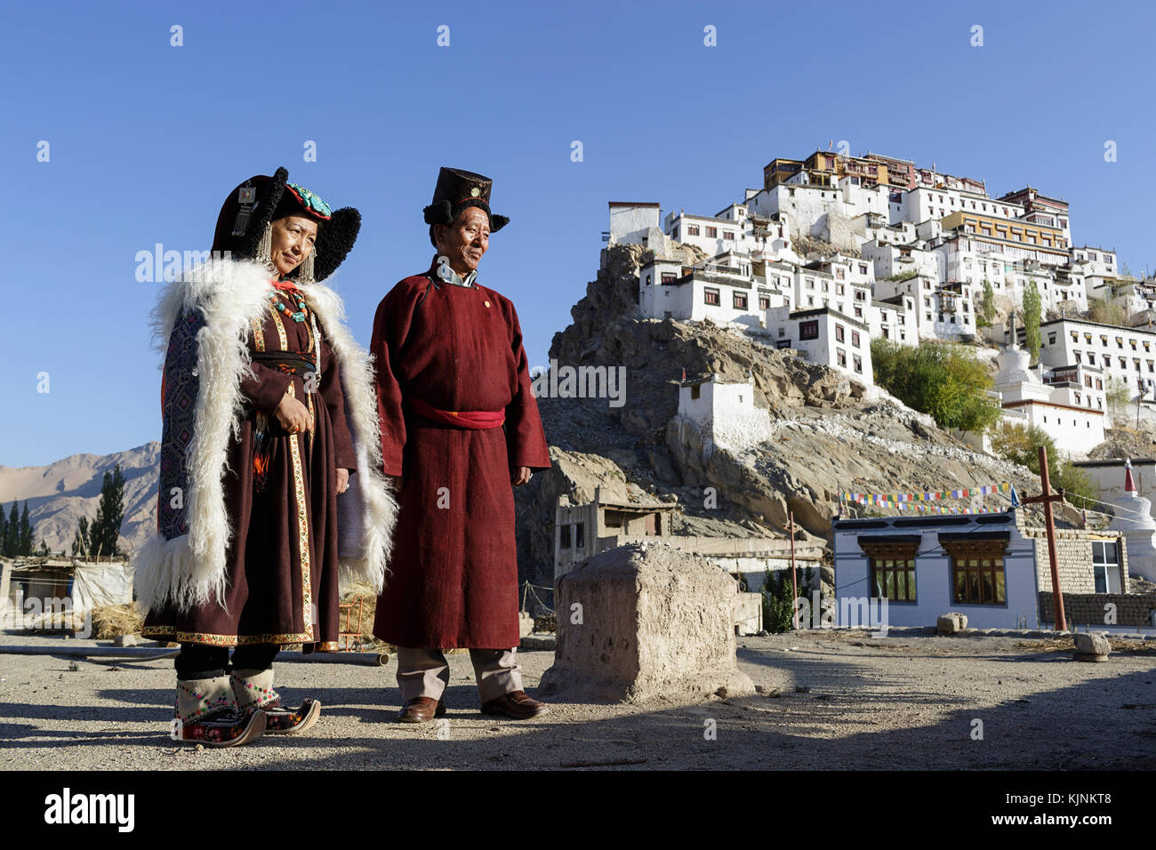 A ladakhi couple wearing traditional costumes on the roof of their ...