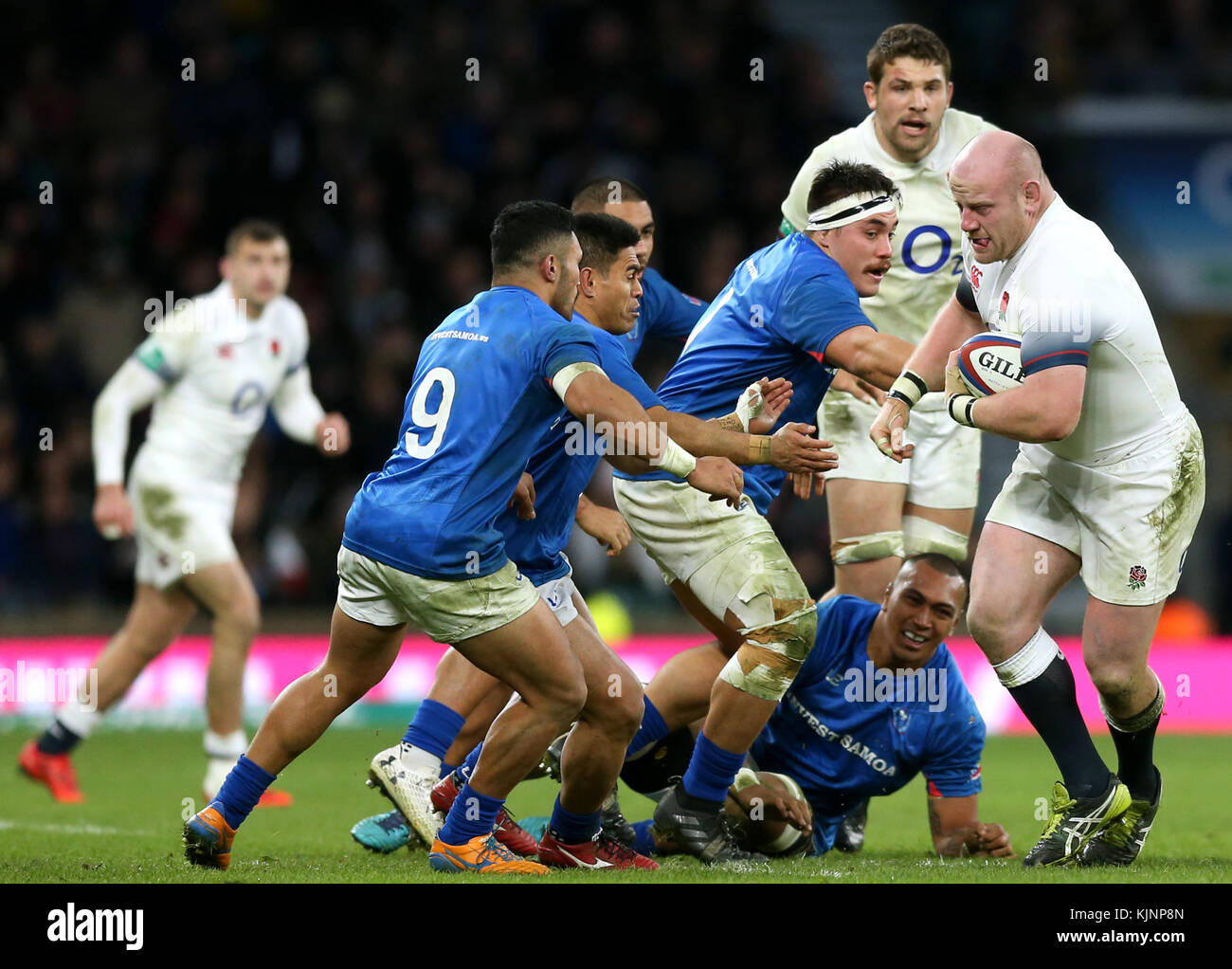 England's Dan Cole (right) and Samoa's Jordan Lay (centre) compete for ...