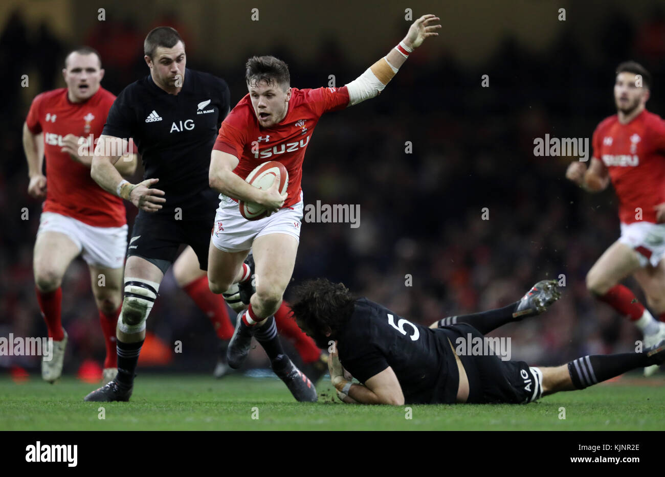 Wales' Steff Evans gets away from New Zealand's Samuel Whitelock (floor ...