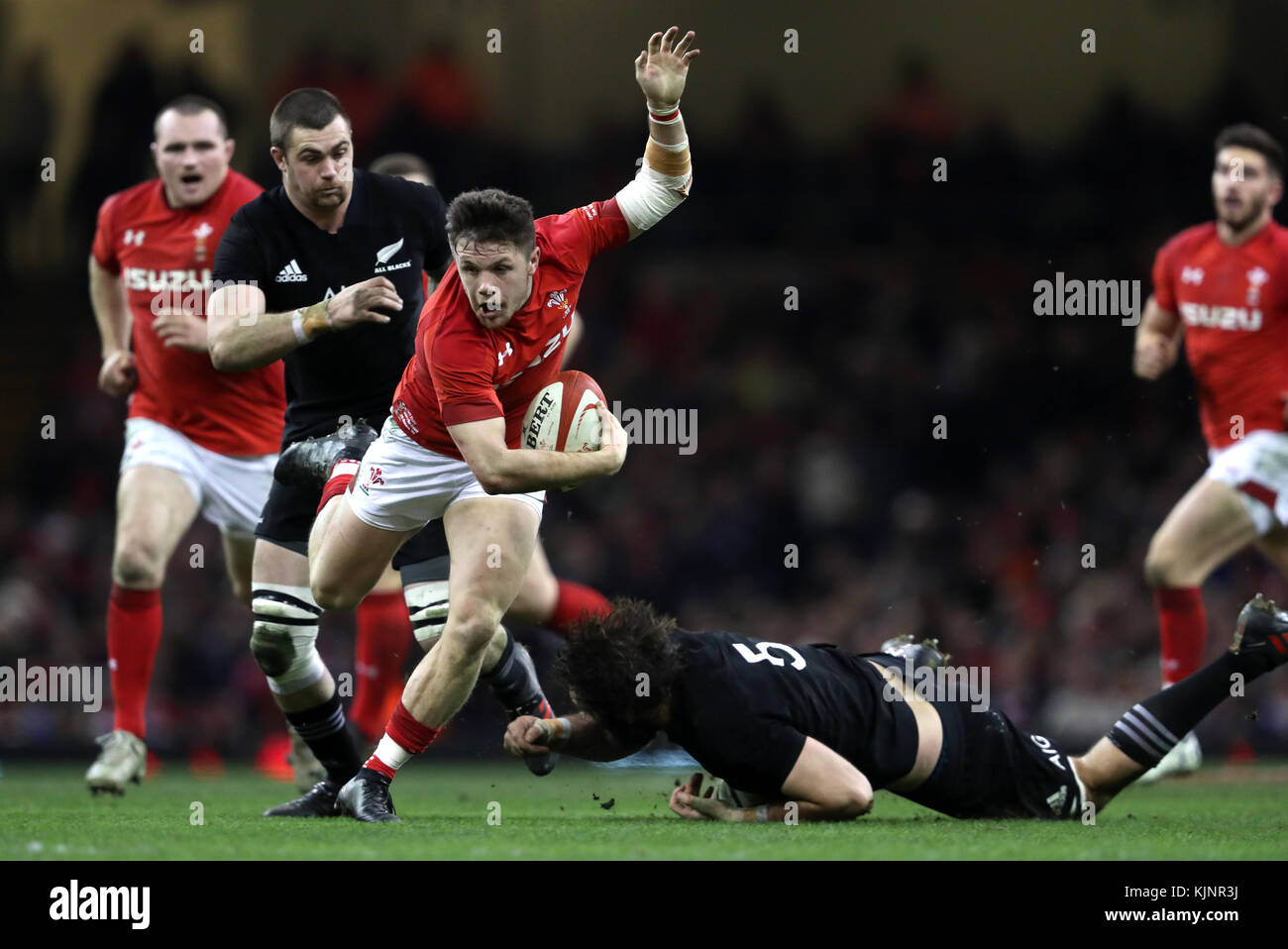 Wales' Steff Evans gets away from New Zealand's Samuel Whitelock (floor ...