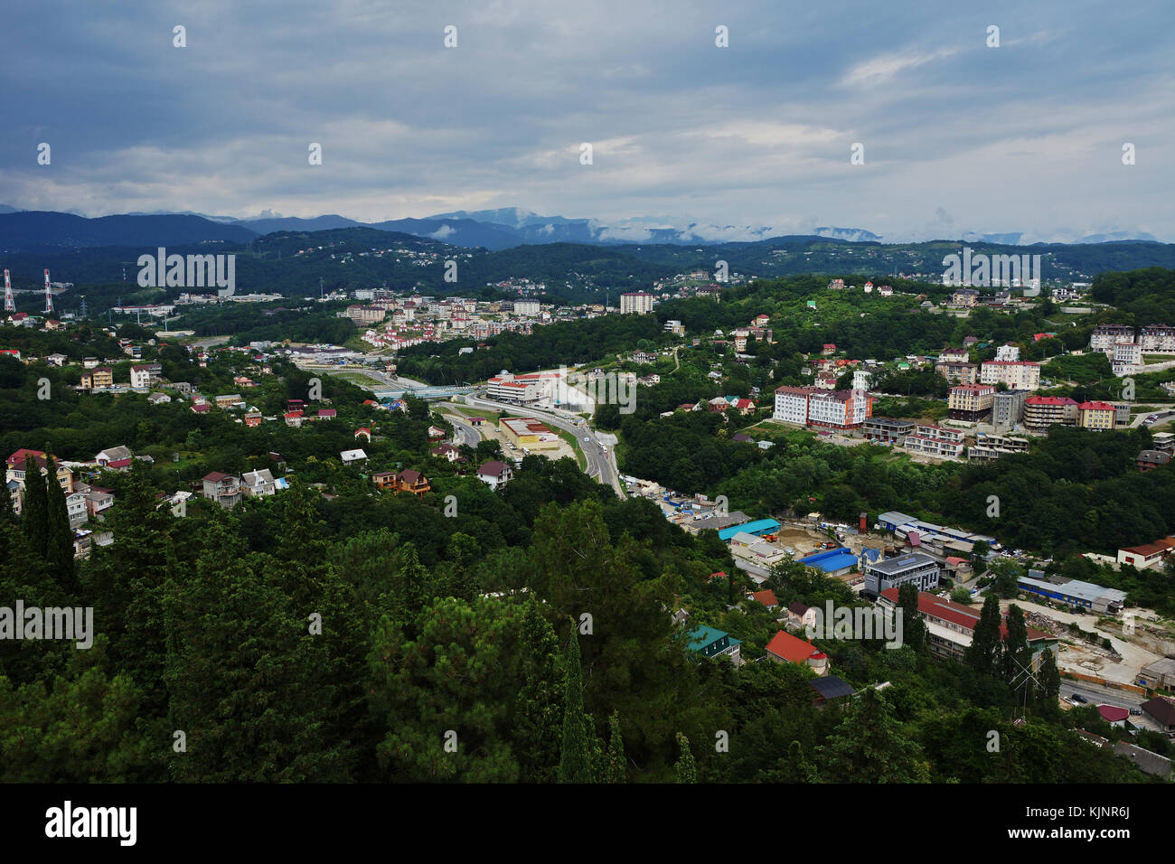 Panorama of Sochi from the air. Houses, streets, trees, the sky are ...