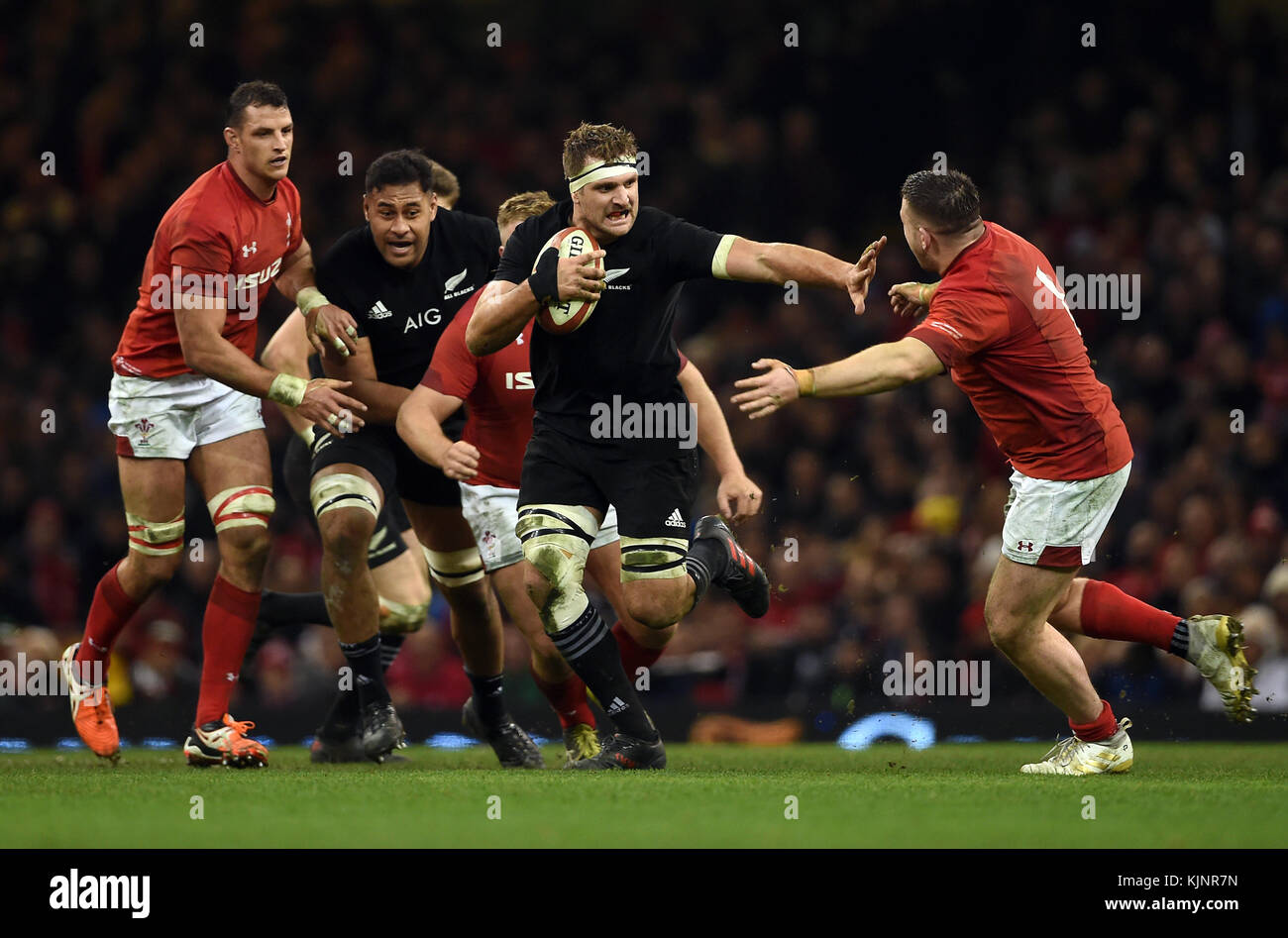 New Zealand's Luke Whitelock runs at Wales' Rob Evans (right) during ...