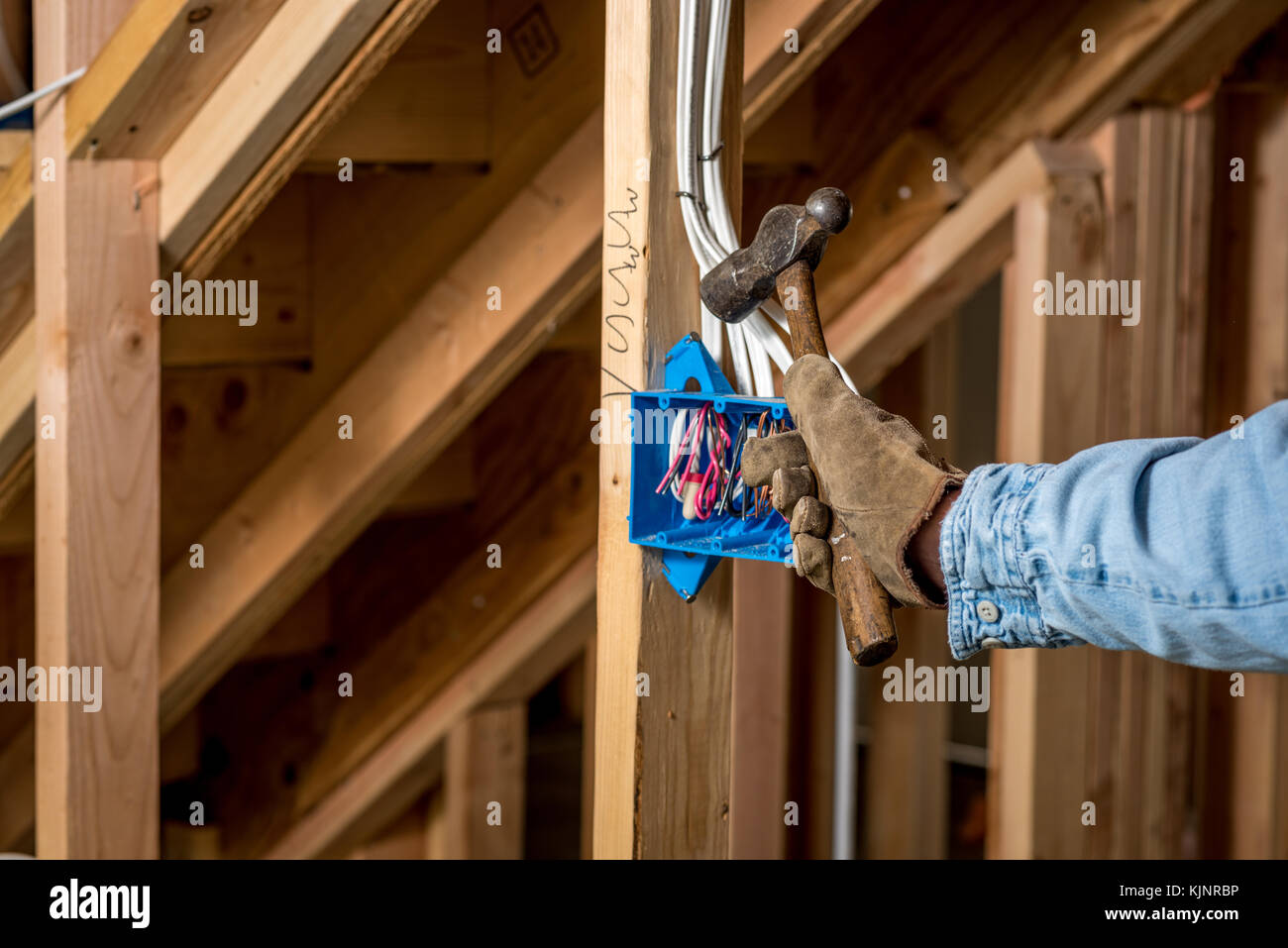 New home construction electrical box installation Stock Photo - Alamy