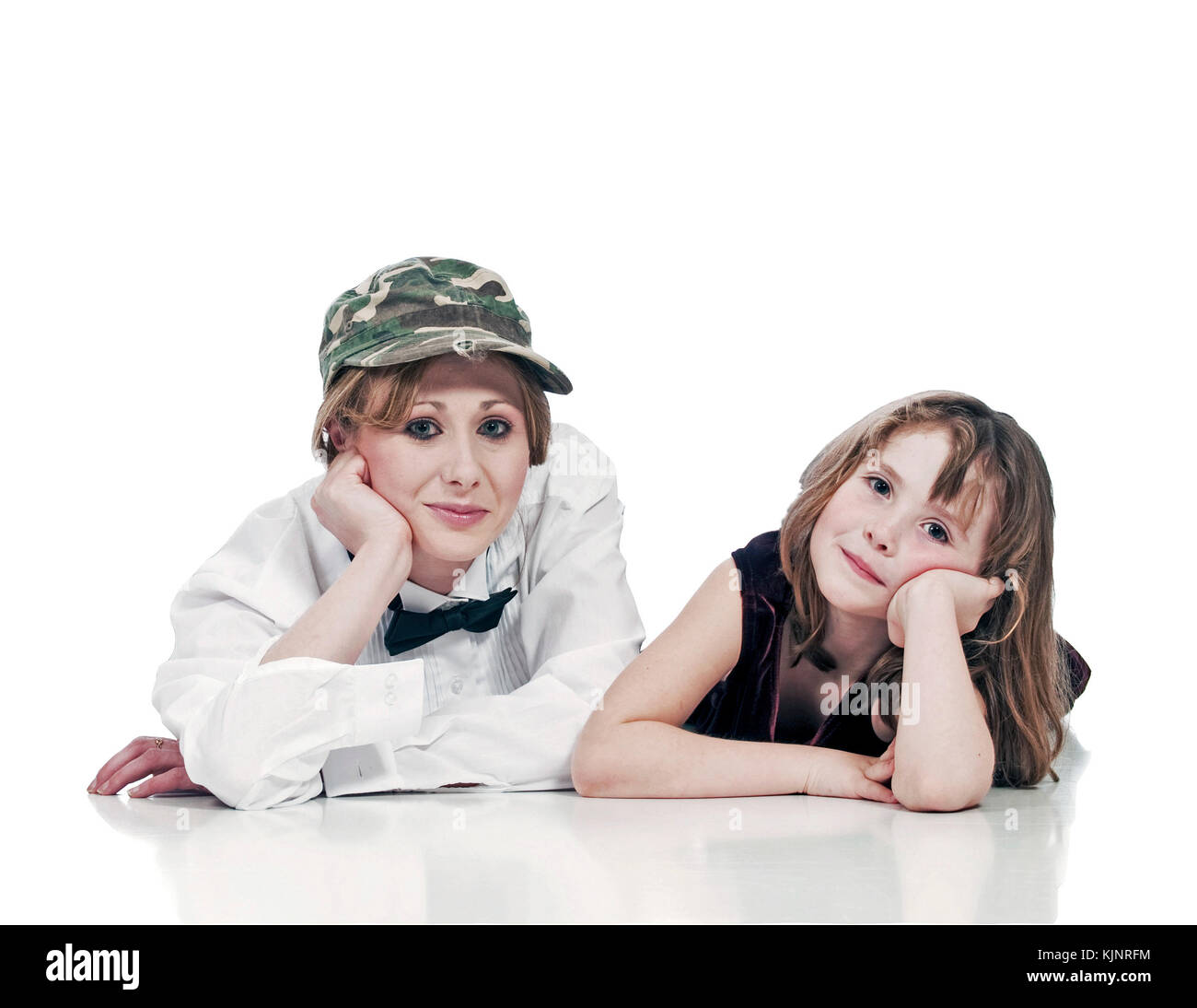 Pretty young woman laying on the floor with her cute little niece Stock ...