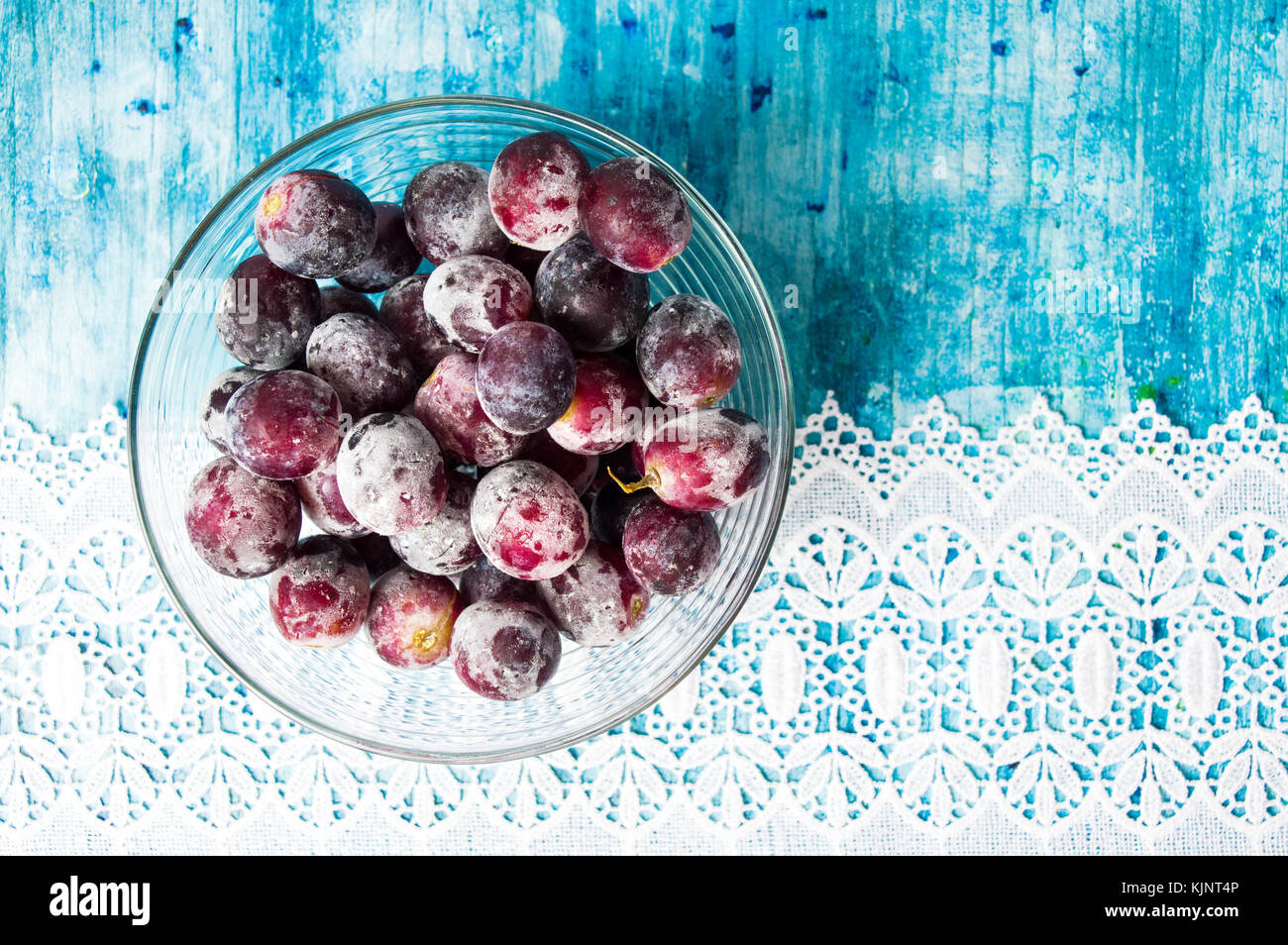 Frozen grapes cluster in the bowl tabletop shot Stock Photo - Alamy
