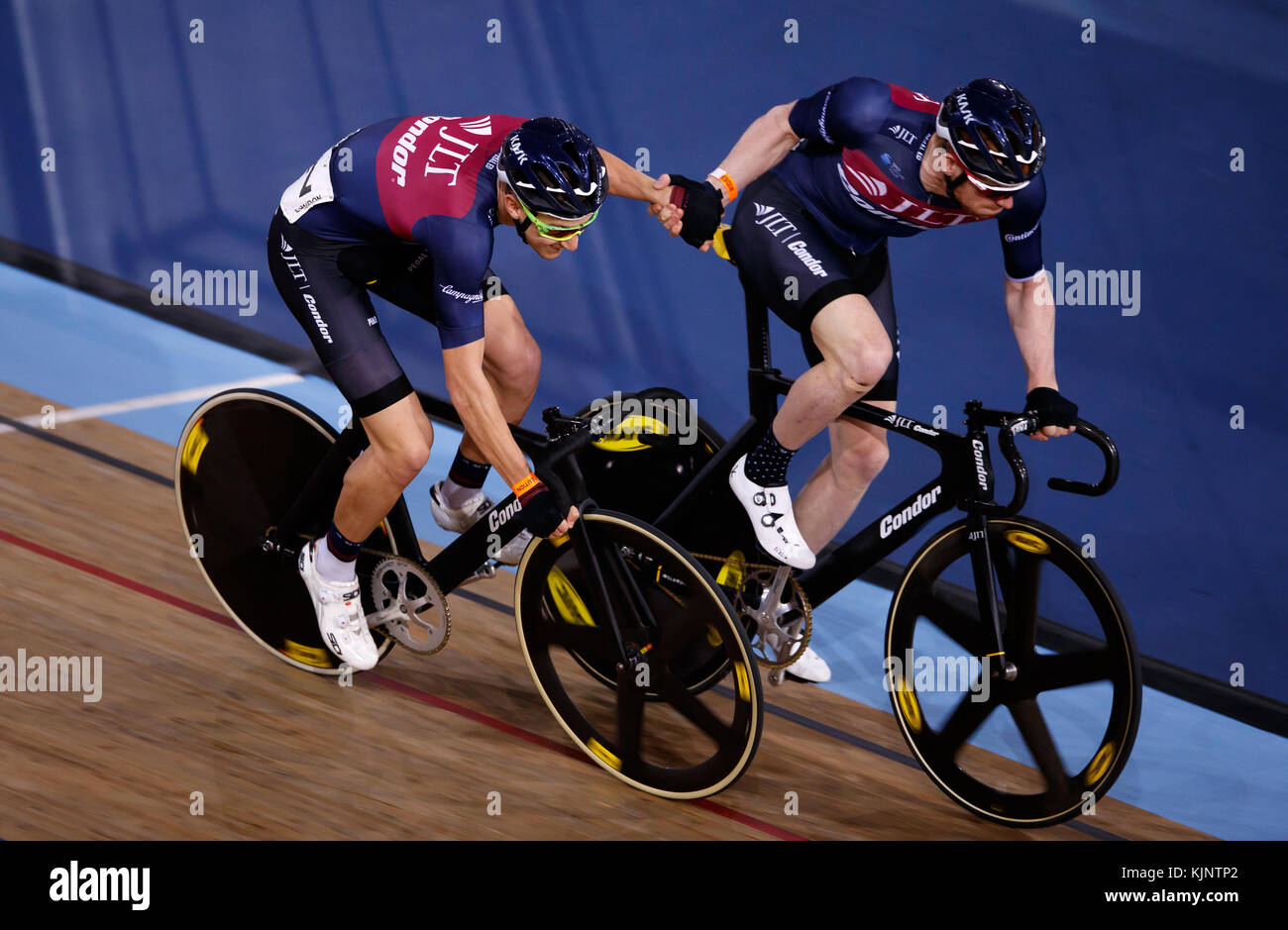 Jon Mould (left) is sligshot in by teammate Ed Clancy during the ...