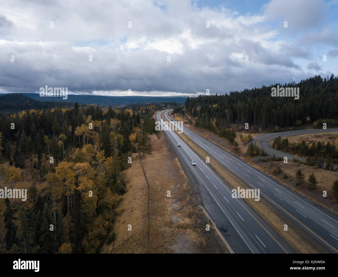 Aerial drone view of a scenic highway, Coquihalla Hwy, in the country ...