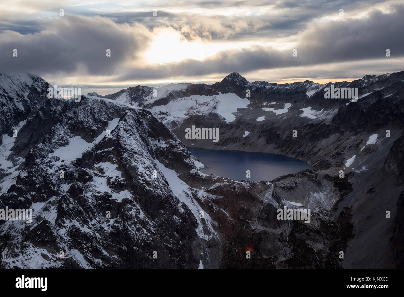 Aerial abstract landscape of the rugged mountains covered in clouds ...