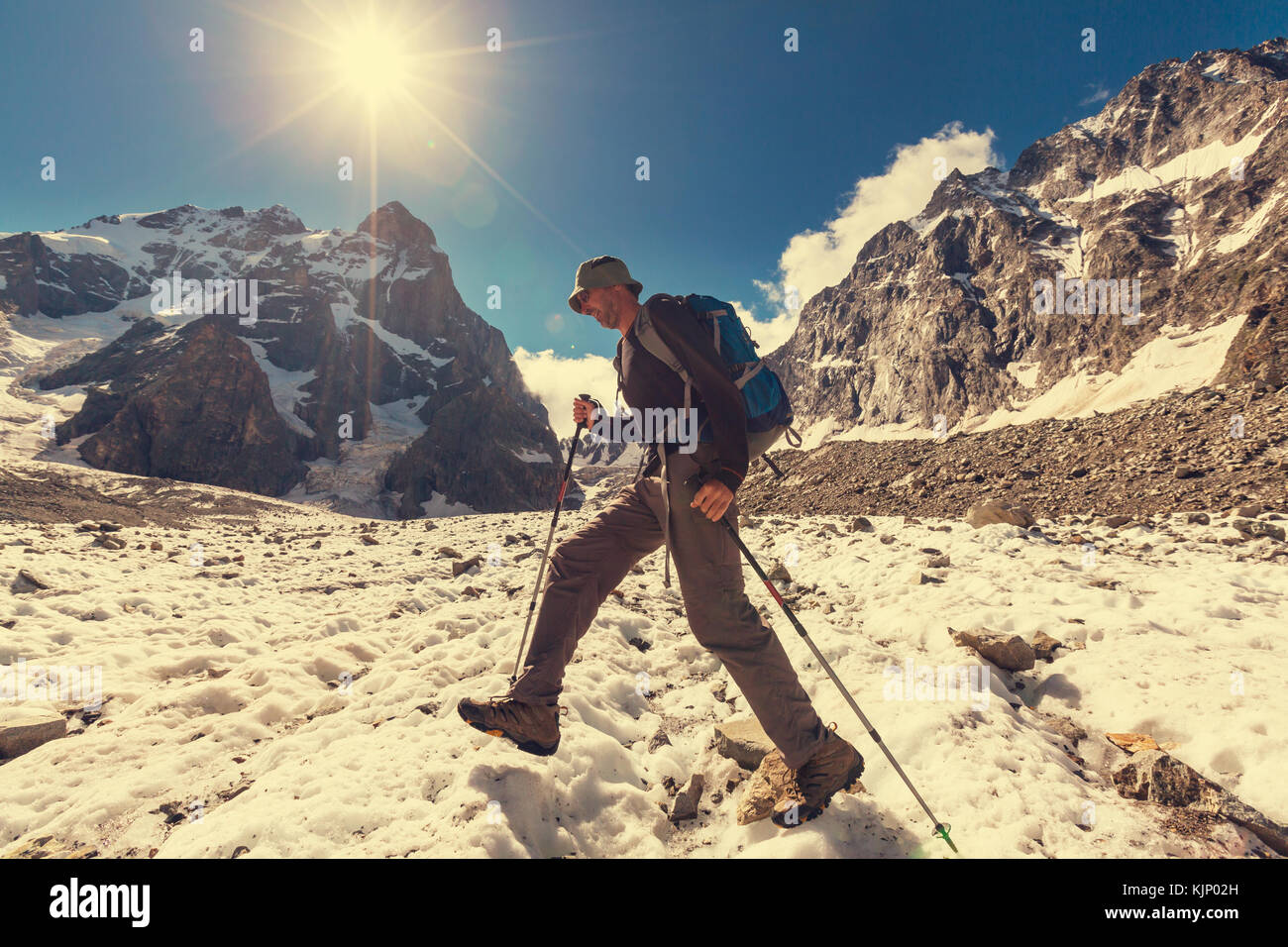 Backpacker in mountains Stock Photo - Alamy