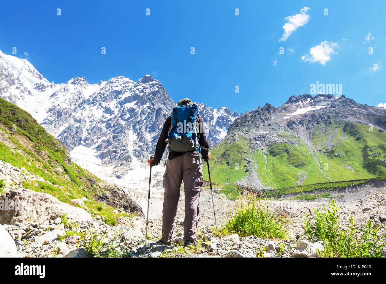 Backpacker in mountains Stock Photo - Alamy