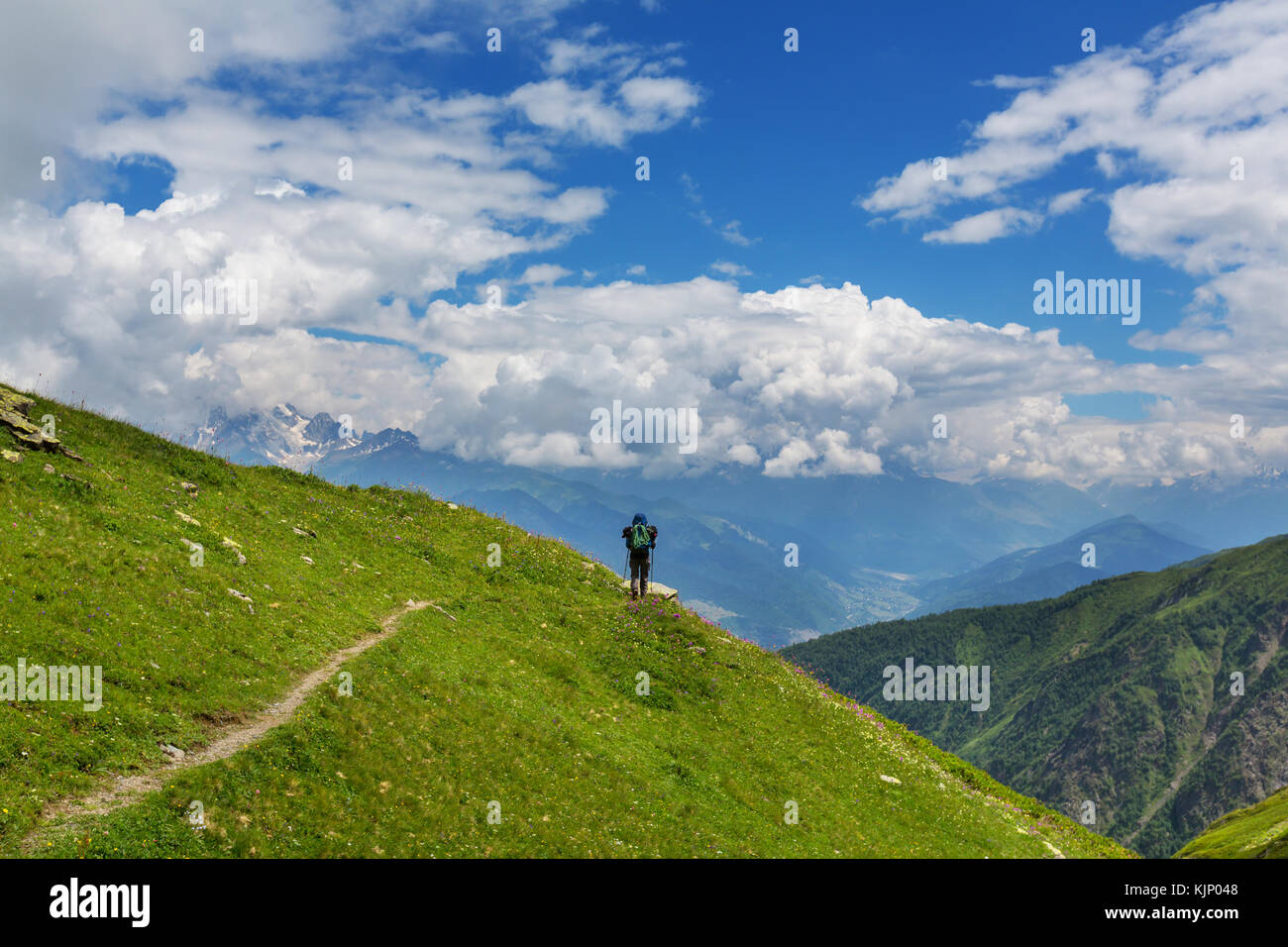 Backpacker in mountains Stock Photo - Alamy