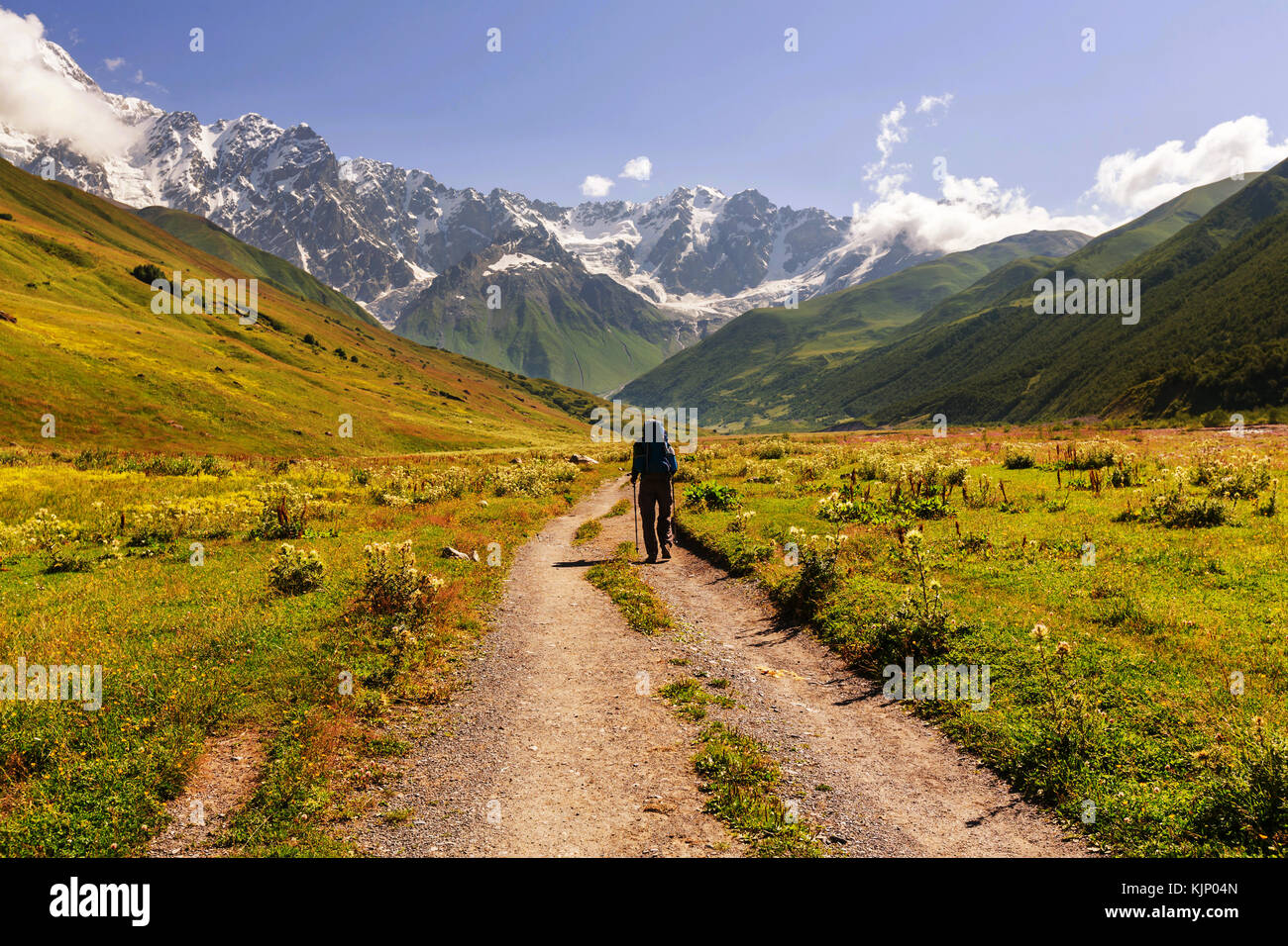 Backpacker in mountains Stock Photo - Alamy