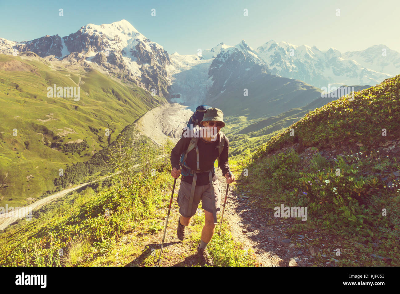 Backpacker in mountains Stock Photo - Alamy
