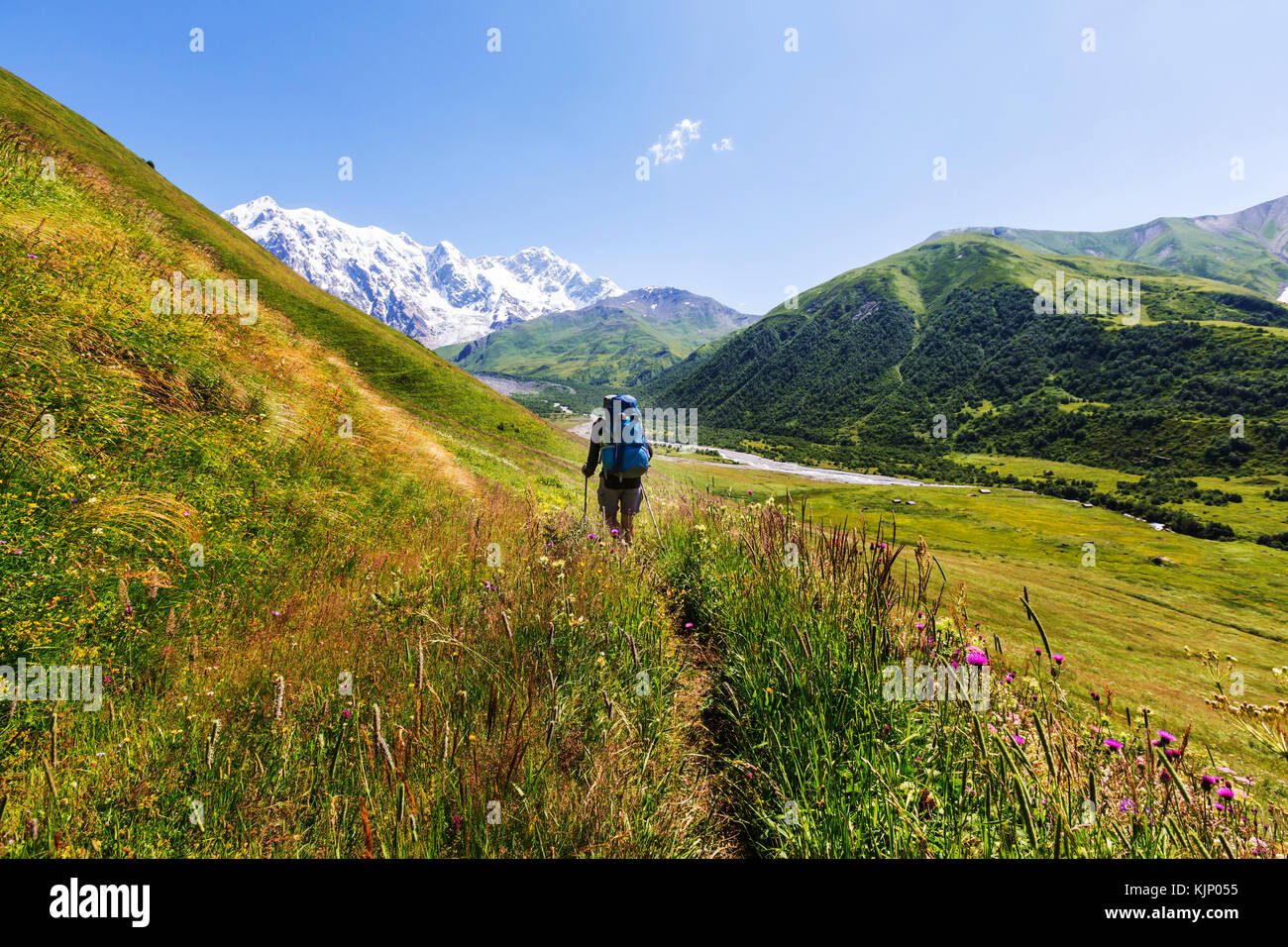 Backpacker in mountains Stock Photo - Alamy