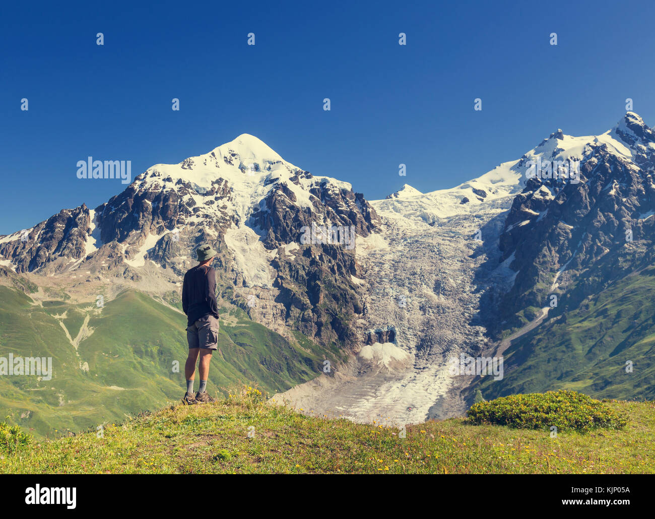 Backpacker in mountains Stock Photo - Alamy