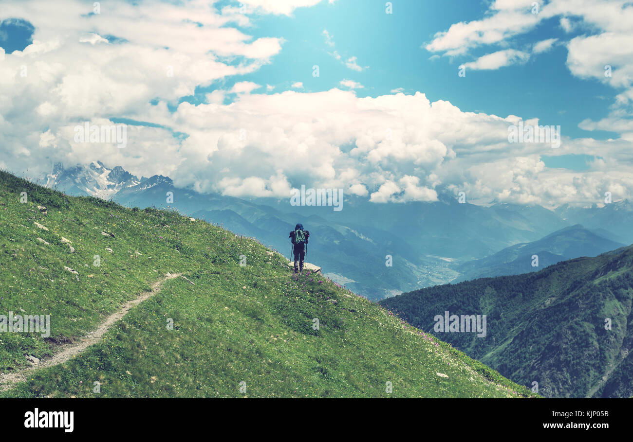 Backpacker in mountains Stock Photo - Alamy