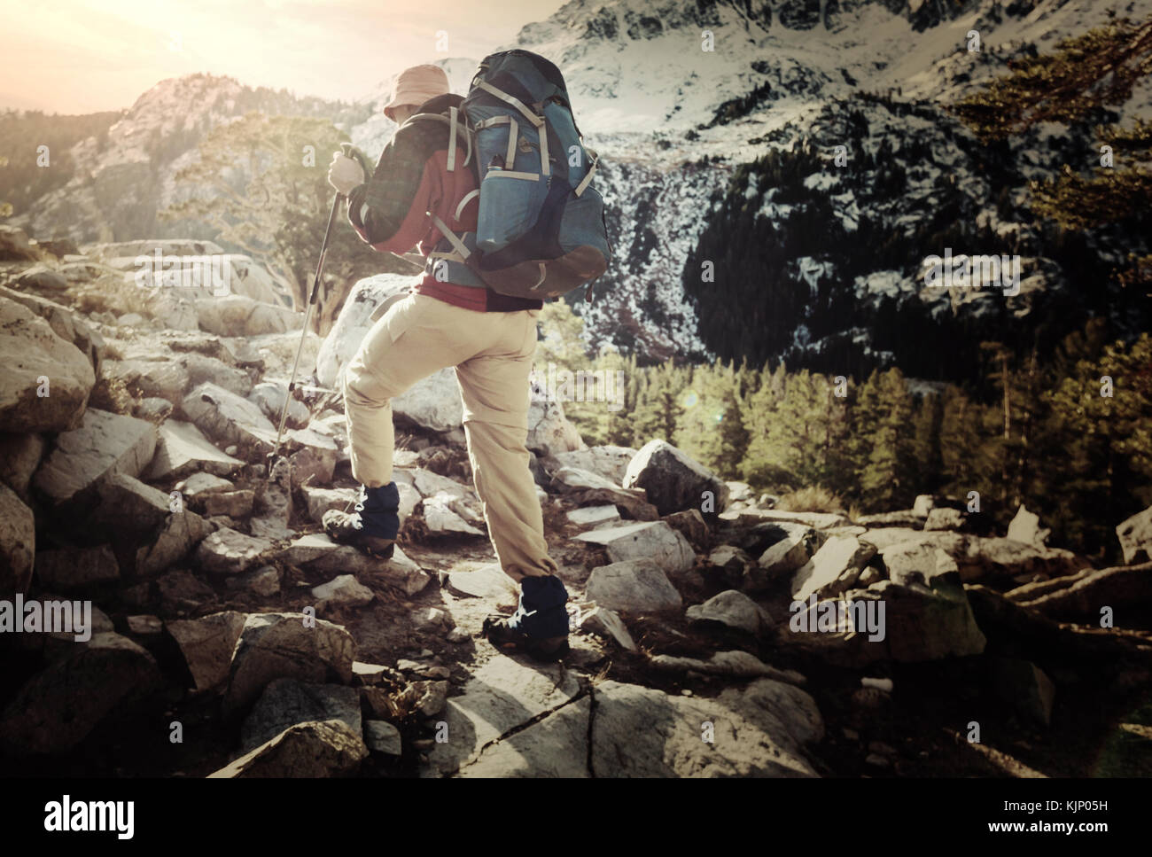 Backpacker in mountains Stock Photo - Alamy