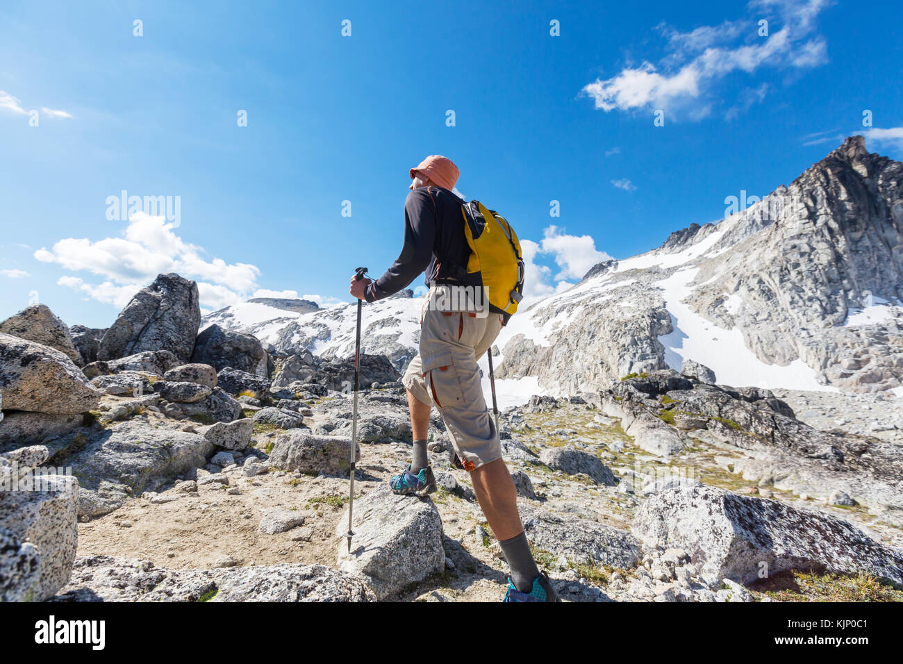 Hiking man in the mountains Stock Photo - Alamy