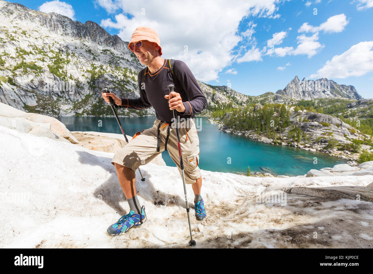 Hiking man in the mountains Stock Photo - Alamy