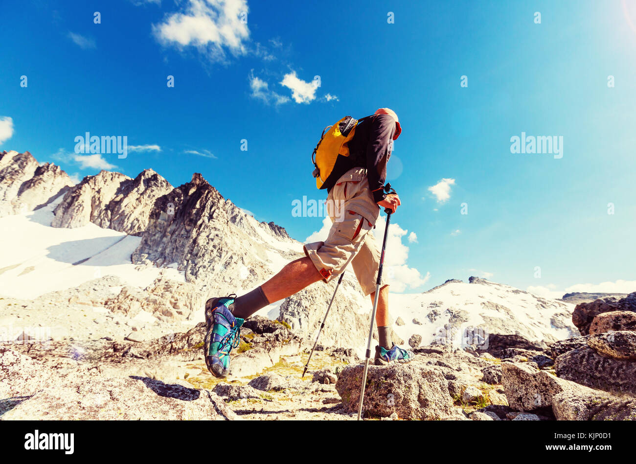 Hiking man in the mountains Stock Photo - Alamy