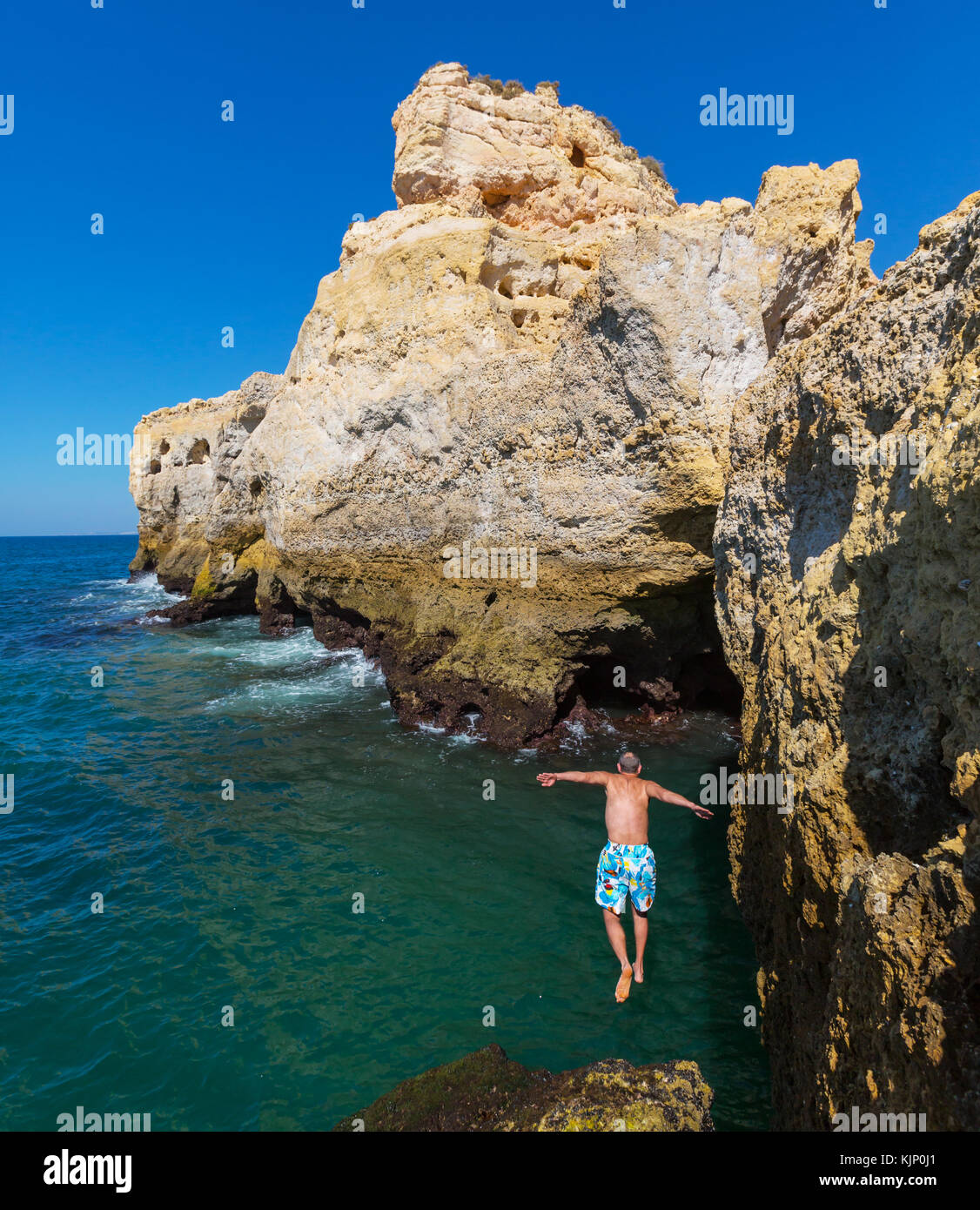 Jumping in ocean Stock Photo - Alamy
