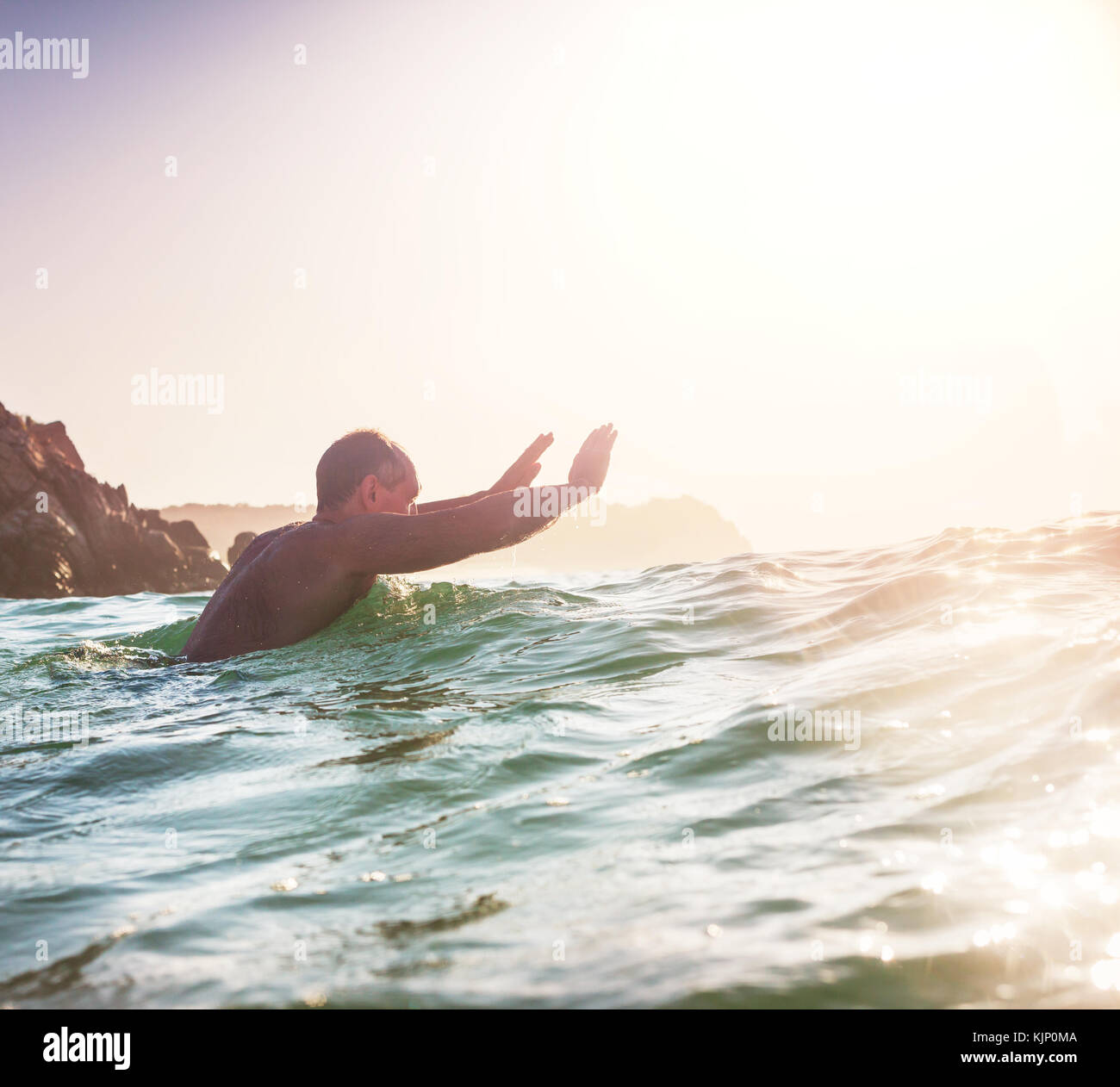 happy men in ocean Stock Photo - Alamy