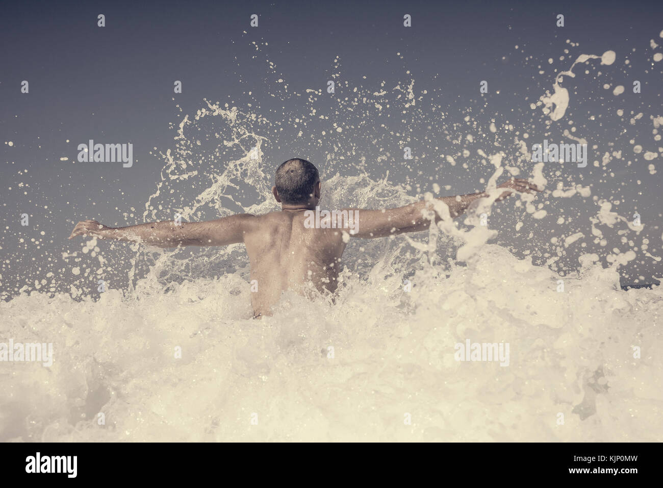 happy men in ocean Stock Photo - Alamy