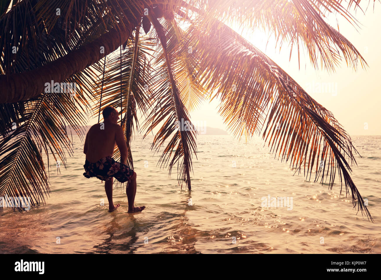Man on beach Stock Photo - Alamy