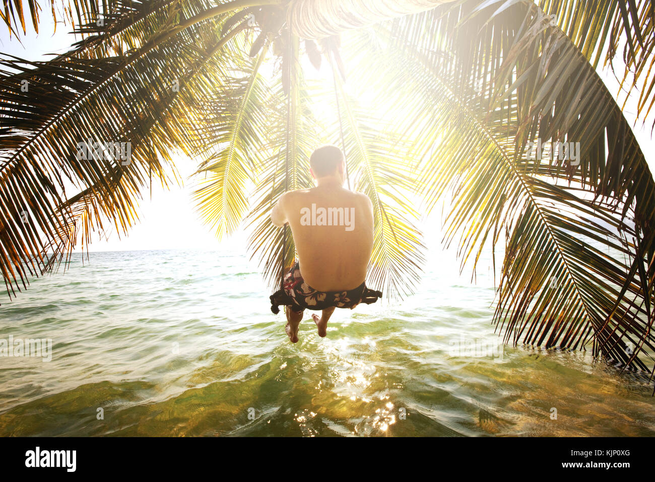 Man on beach Stock Photo - Alamy