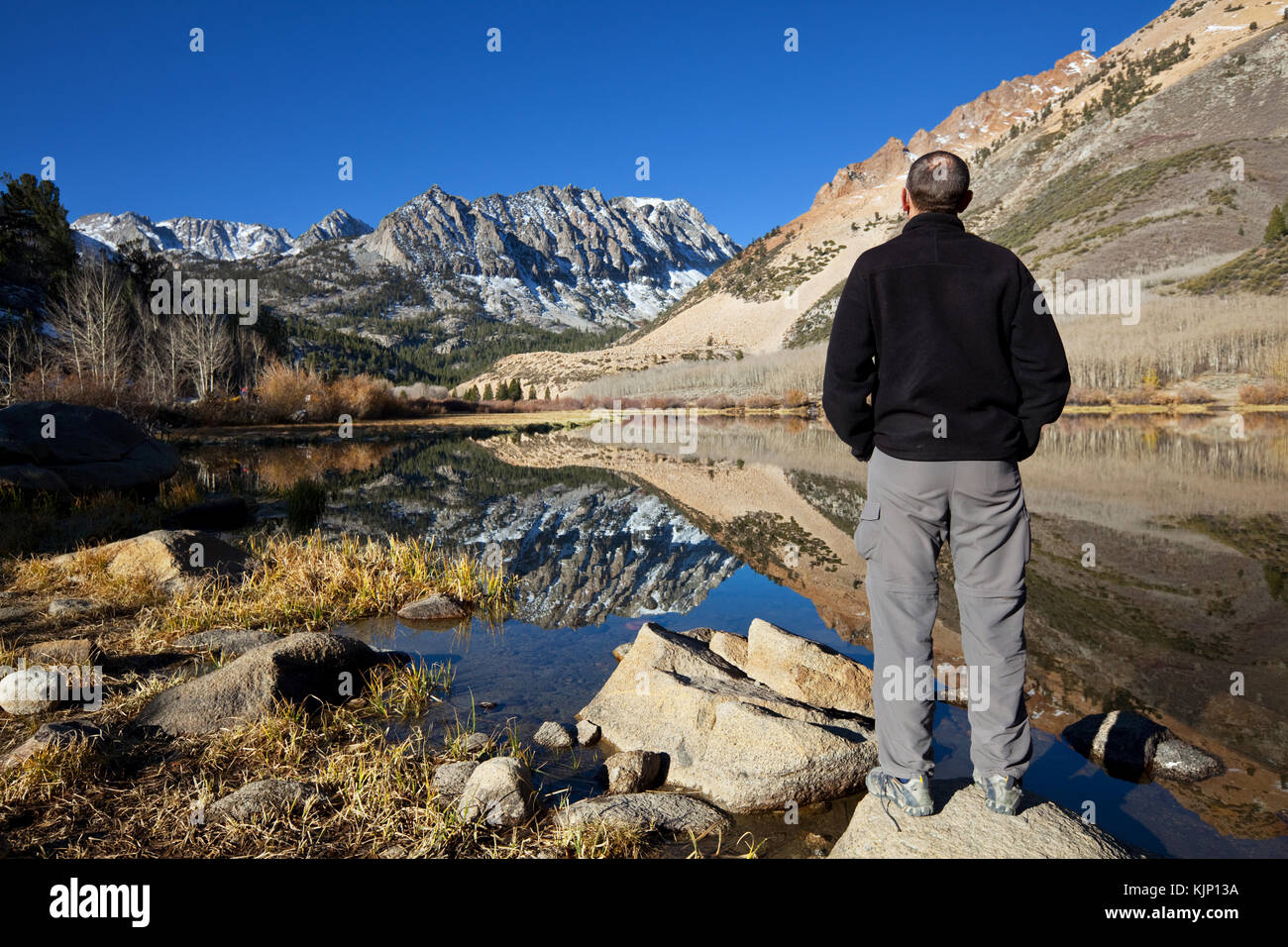 Man on summer lake Stock Photo - Alamy