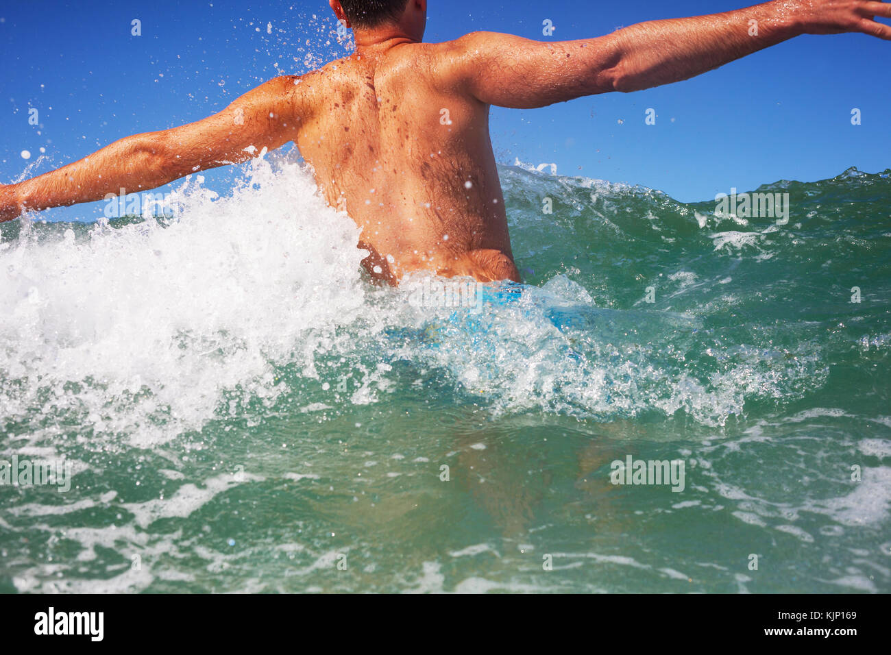 man in wave Stock Photo - Alamy