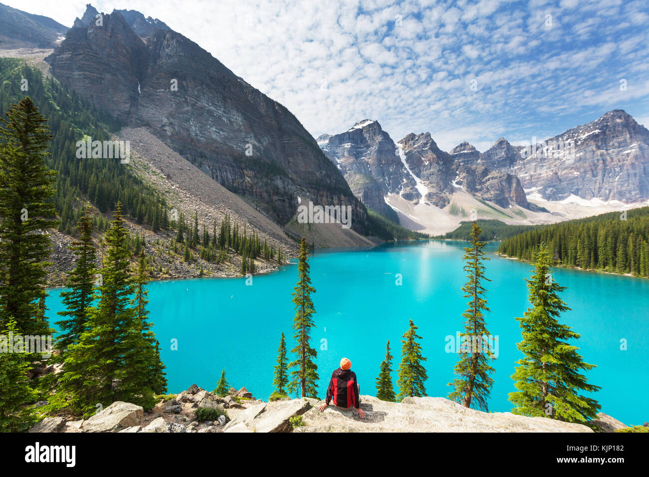 Beautiful turquoise waters of the Moraine lake with snow-covered peaks ...