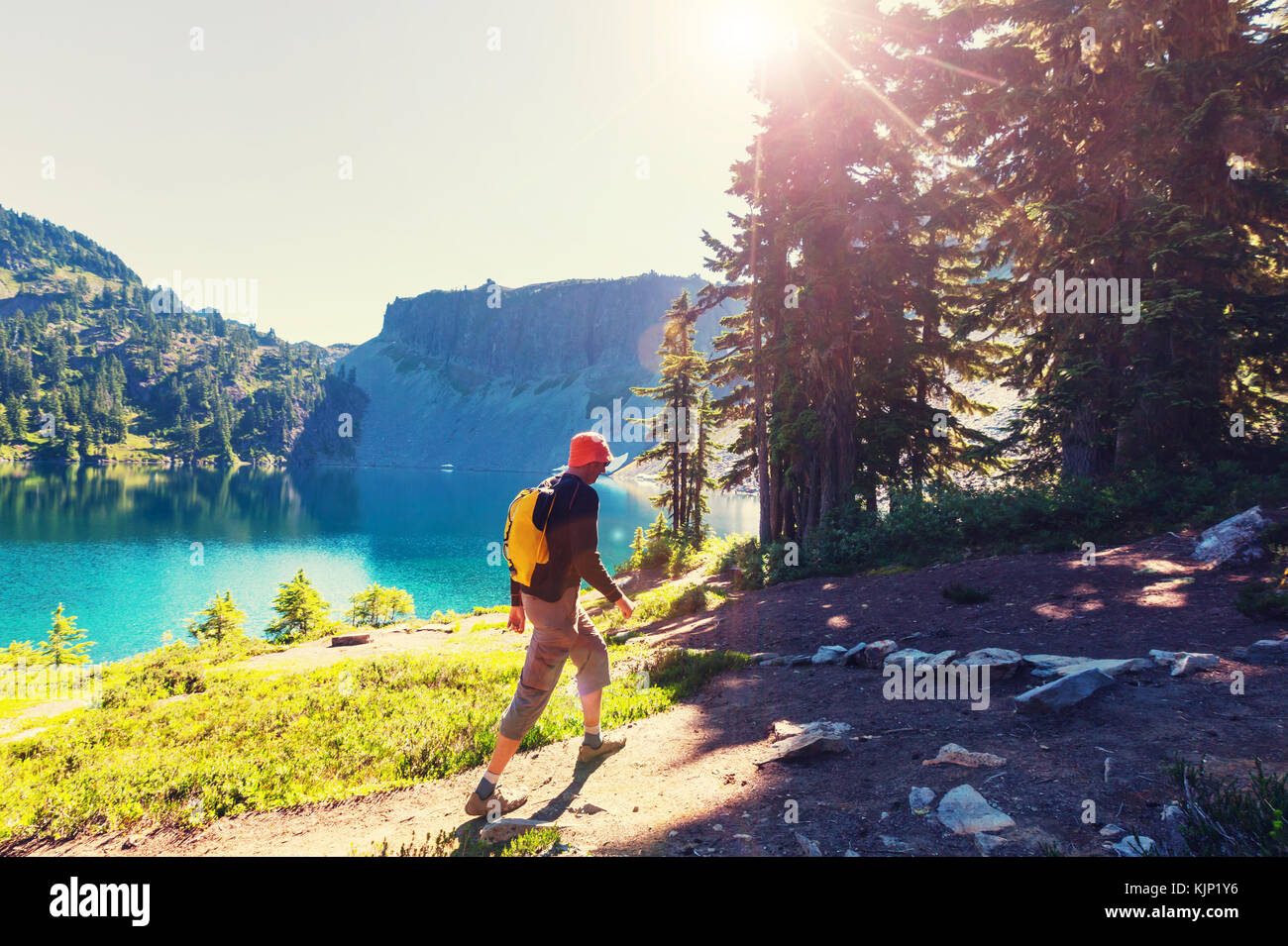 Backpacker in summer mountains Stock Photo - Alamy