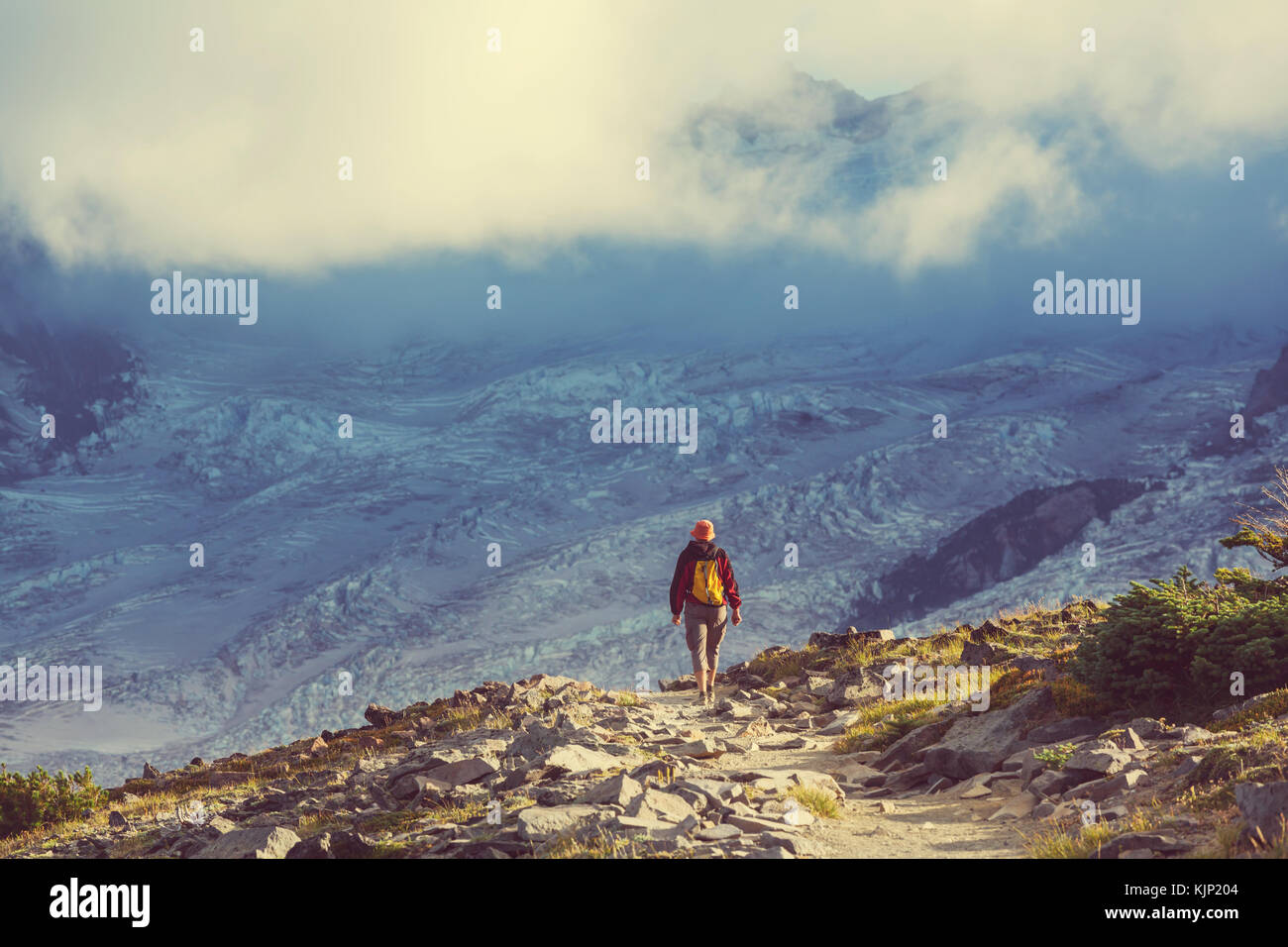 Backpacker in the summer mountains Stock Photo - Alamy