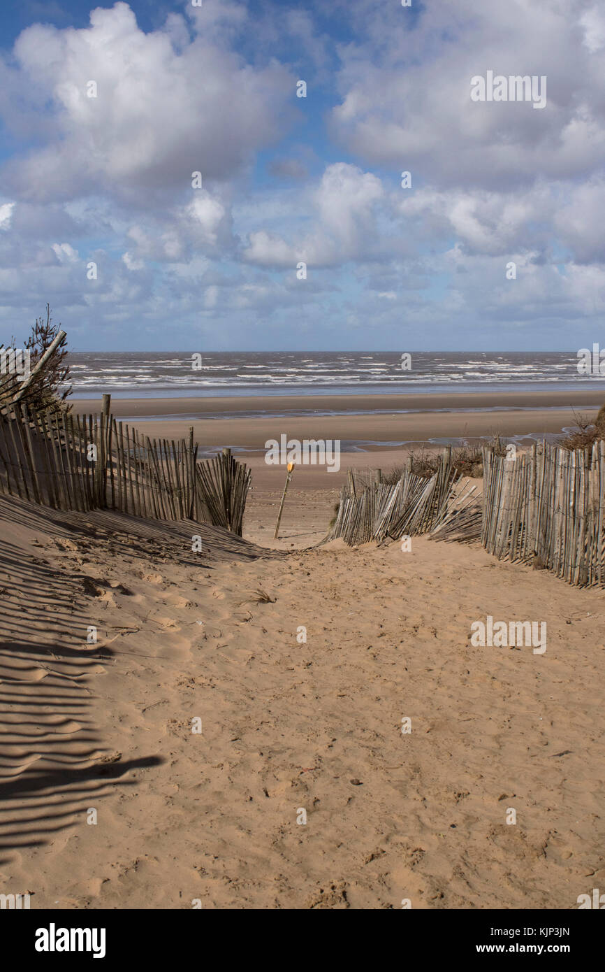 footpath walk up to formby point beach with fencing Stock Photo - Alamy