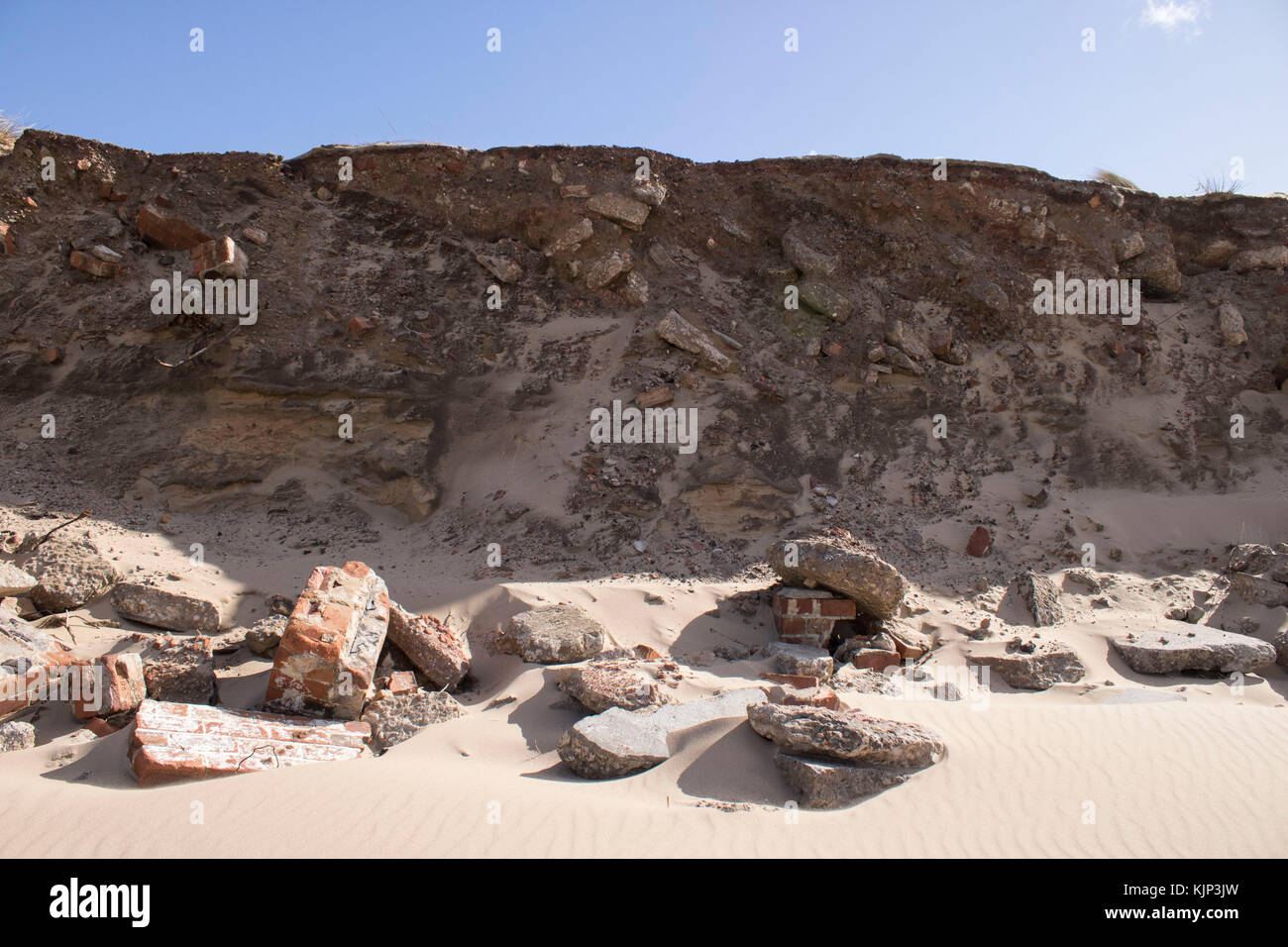fallen bricks from wall at formby beach due to coastal erosion Stock ...