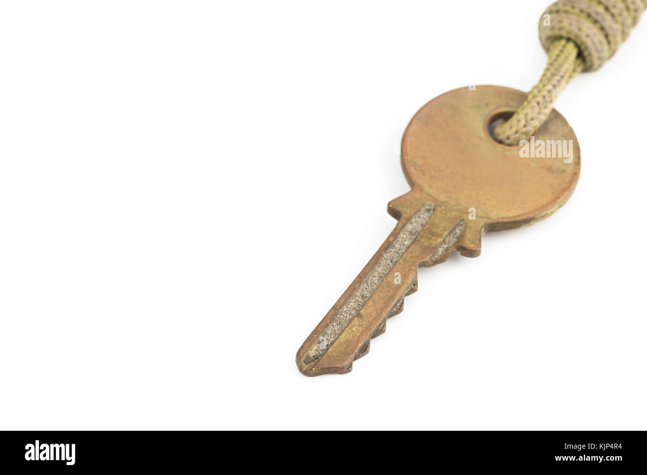 Old brass key with key chain on white background Stock Photo - Alamy