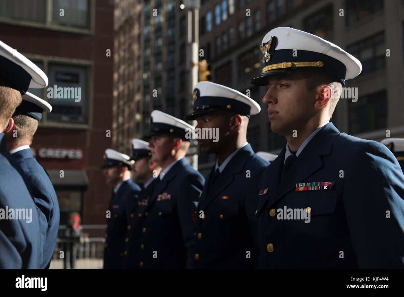 Coast Guard Sector New York members represent the unit while marching ...