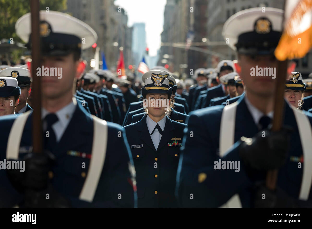 Members of Coast Guard Sector New York stand at attention while ...