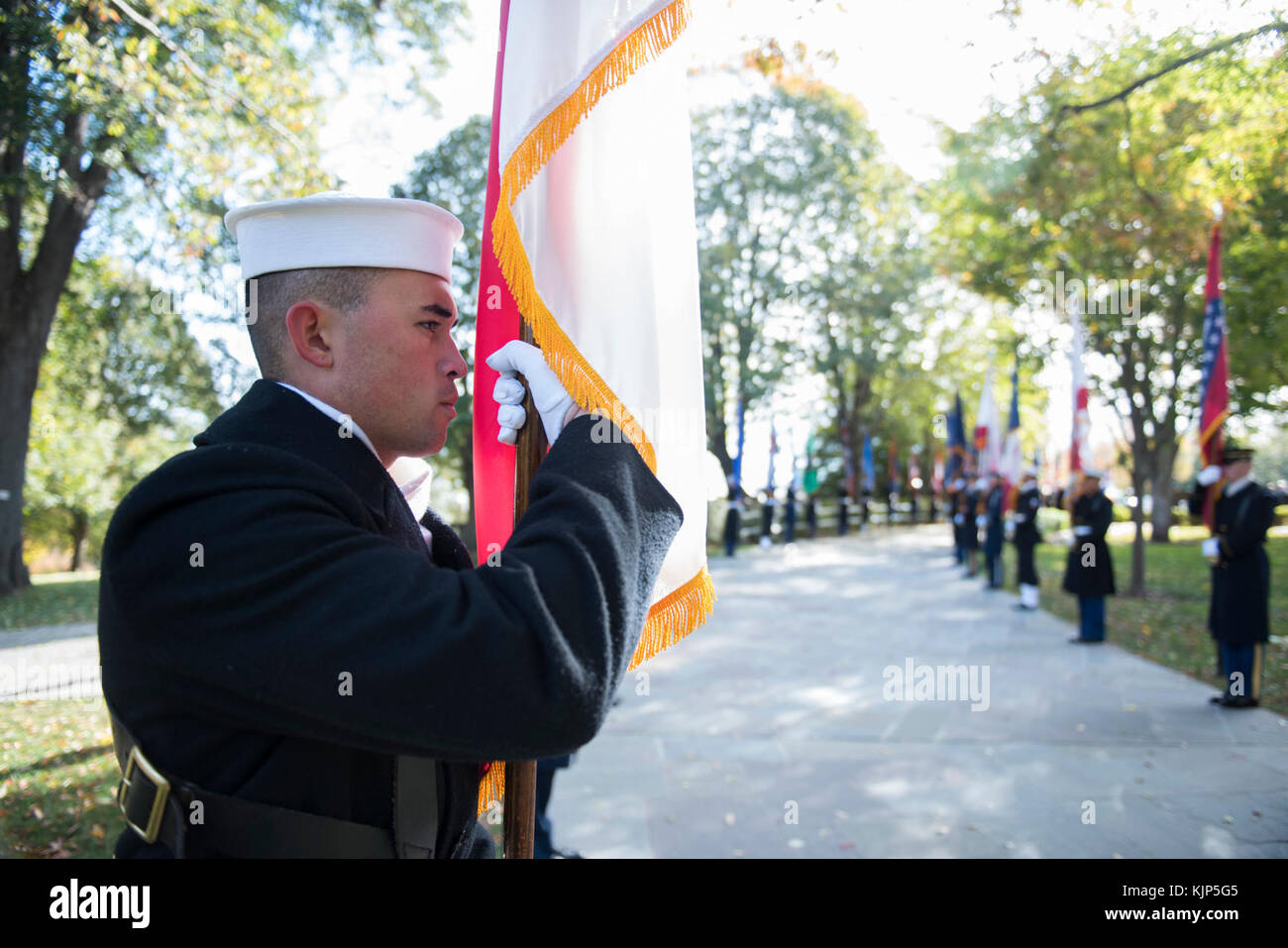 A member of the color guard cordon holds a flag during Veterans Day at ...