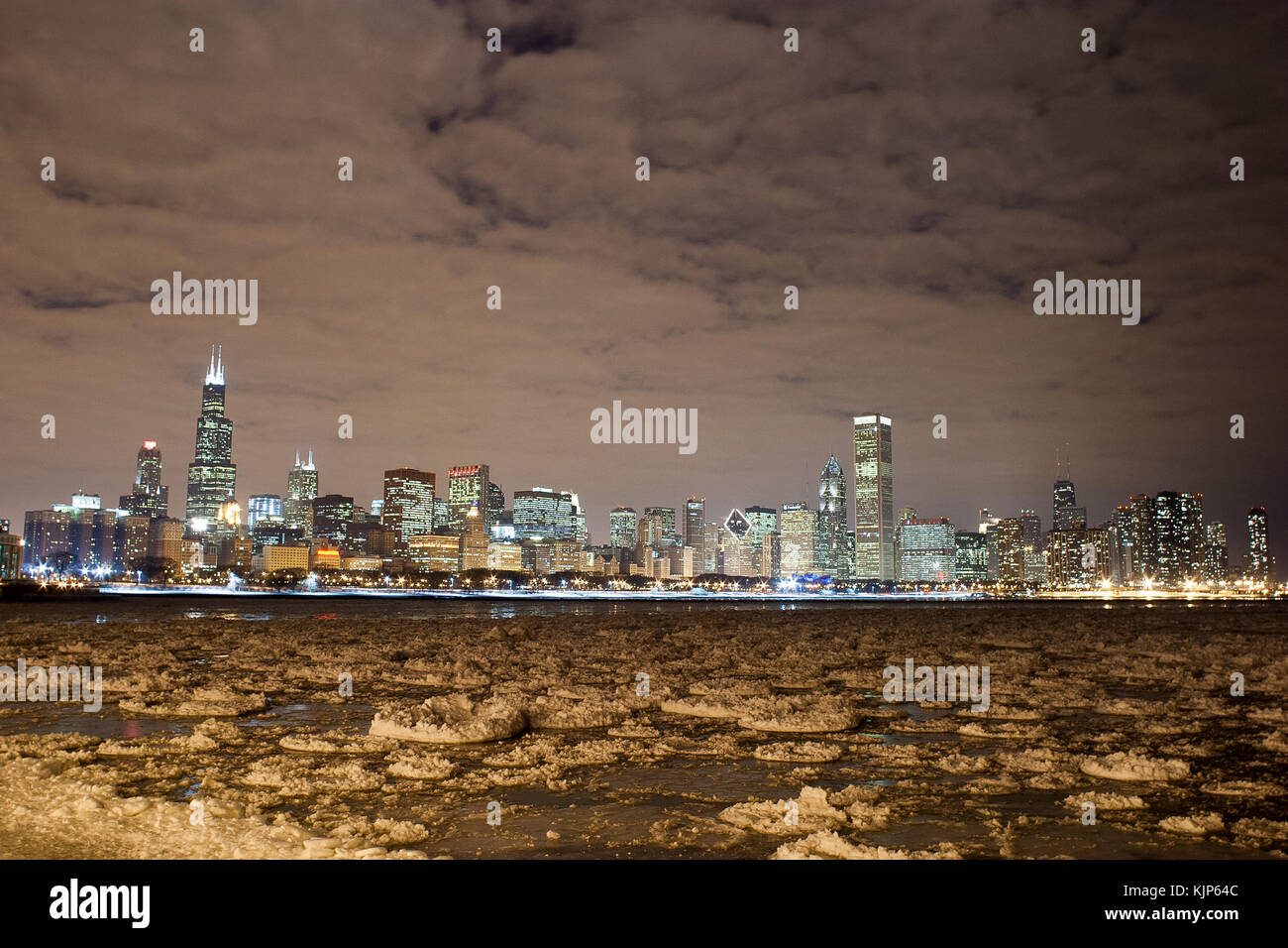 Ice forms on Lake Michigan in front of the iconic skyline of Chicago ...