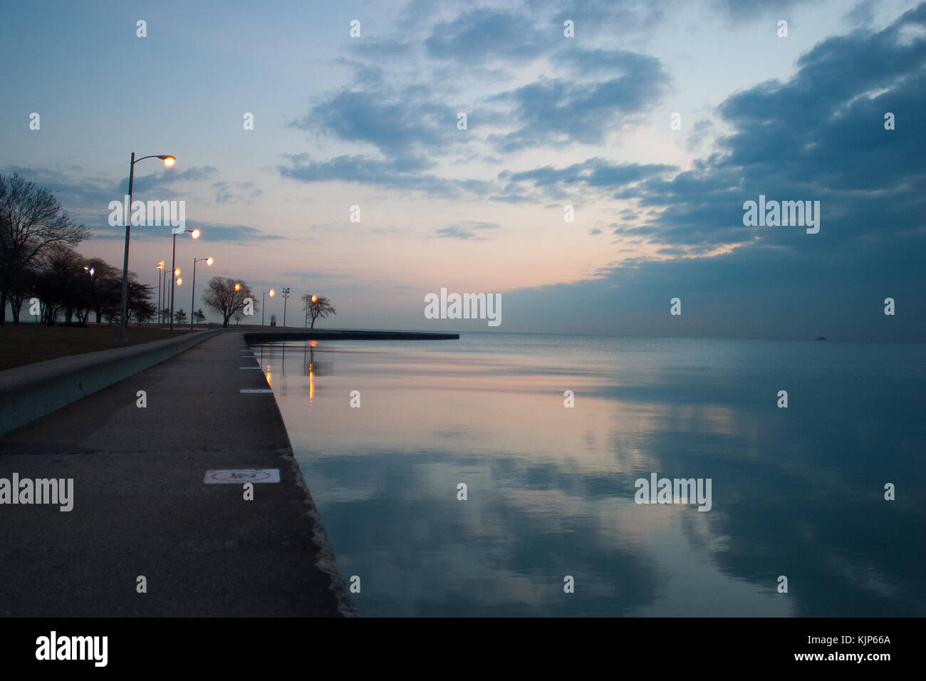 On a cold winter morning, the dawn breaks over the Lake Michigan ...