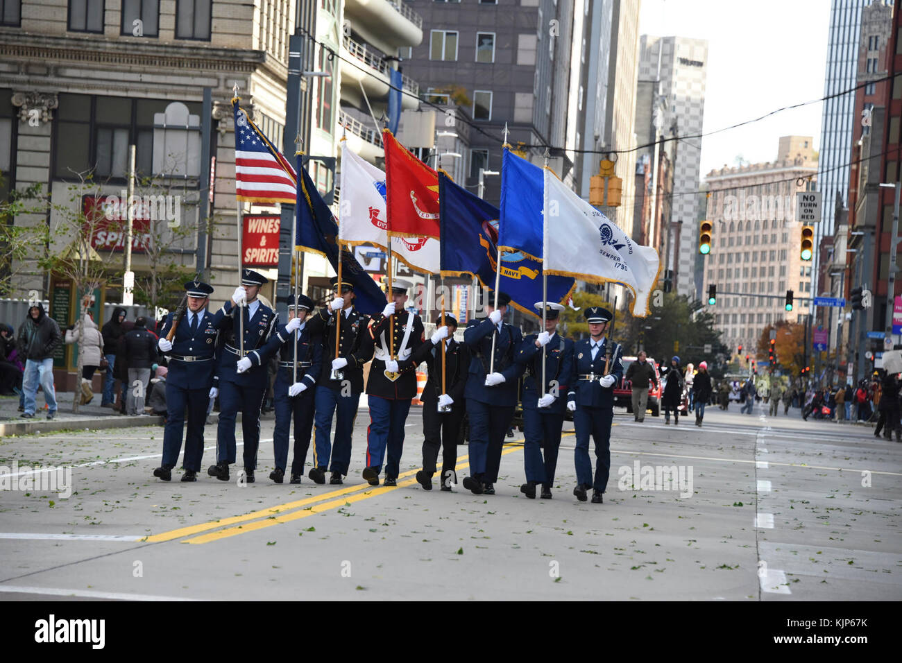 A joint color guard marches down Liberty Avenue in Pittsburgh ...