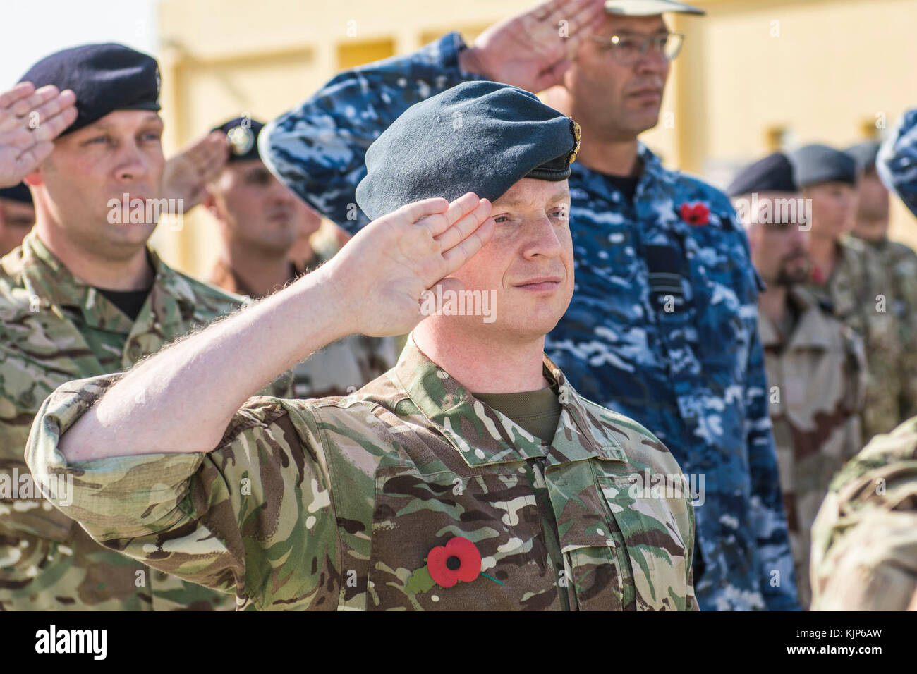 A member of the Royal British Air Force, No. 83 Air Group, salutes to ...