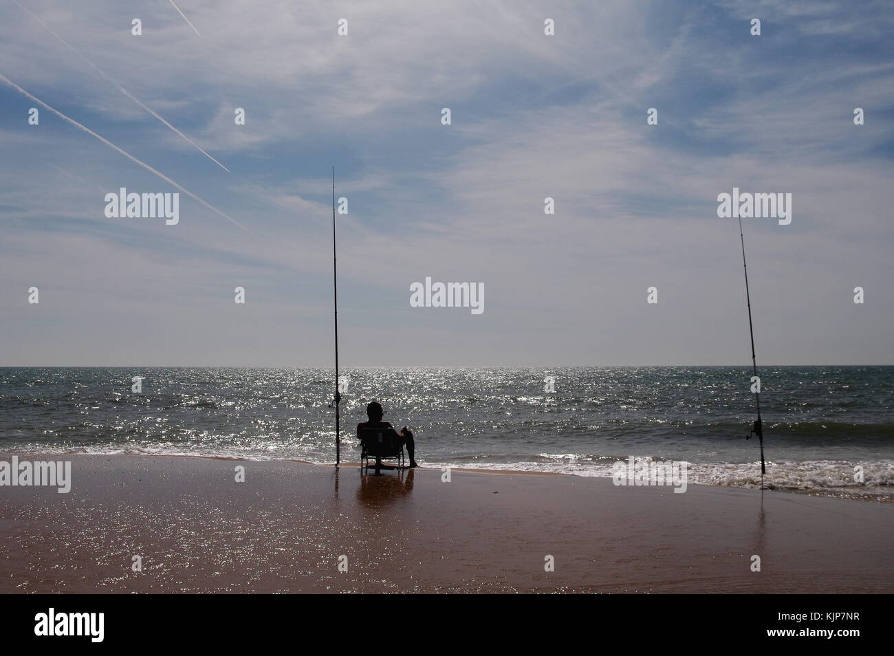 fishermen fishing at beach on the ocean Stock Photo - Alamy