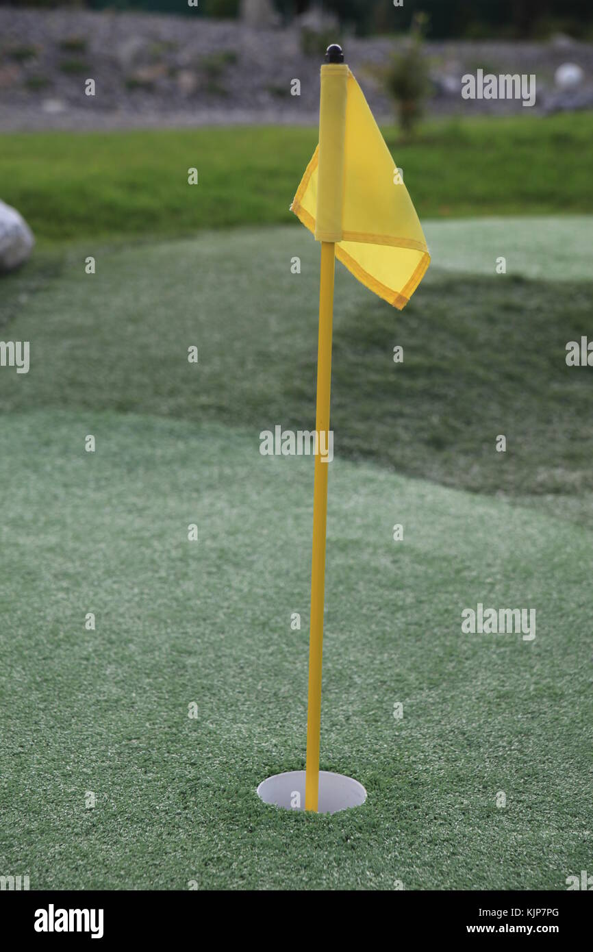 Close up of a pin and cup on a golf hole Stock Photo - Alamy