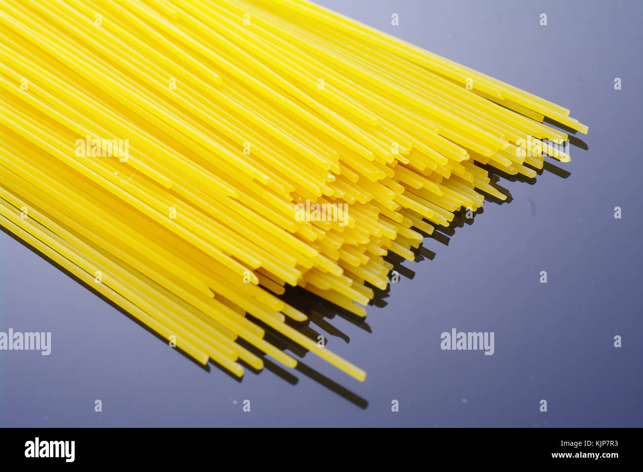 spaghetti against a black background Stock Photo - Alamy