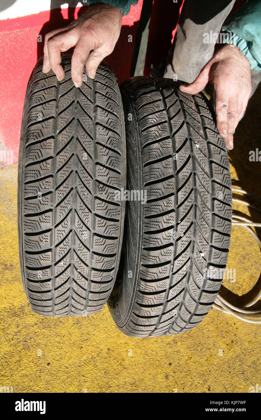 change of tyres for coming cold winter Stock Photo - Alamy