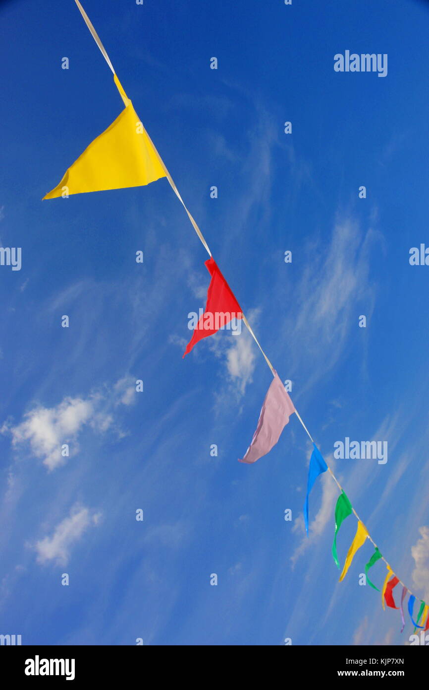 Multi Colored Triangular Flags Hanging in the Sky at an Outdoor ...