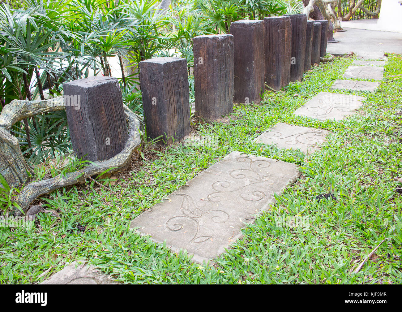 Stone walkway in the park which has Stucco as a wooden pole, Path ...